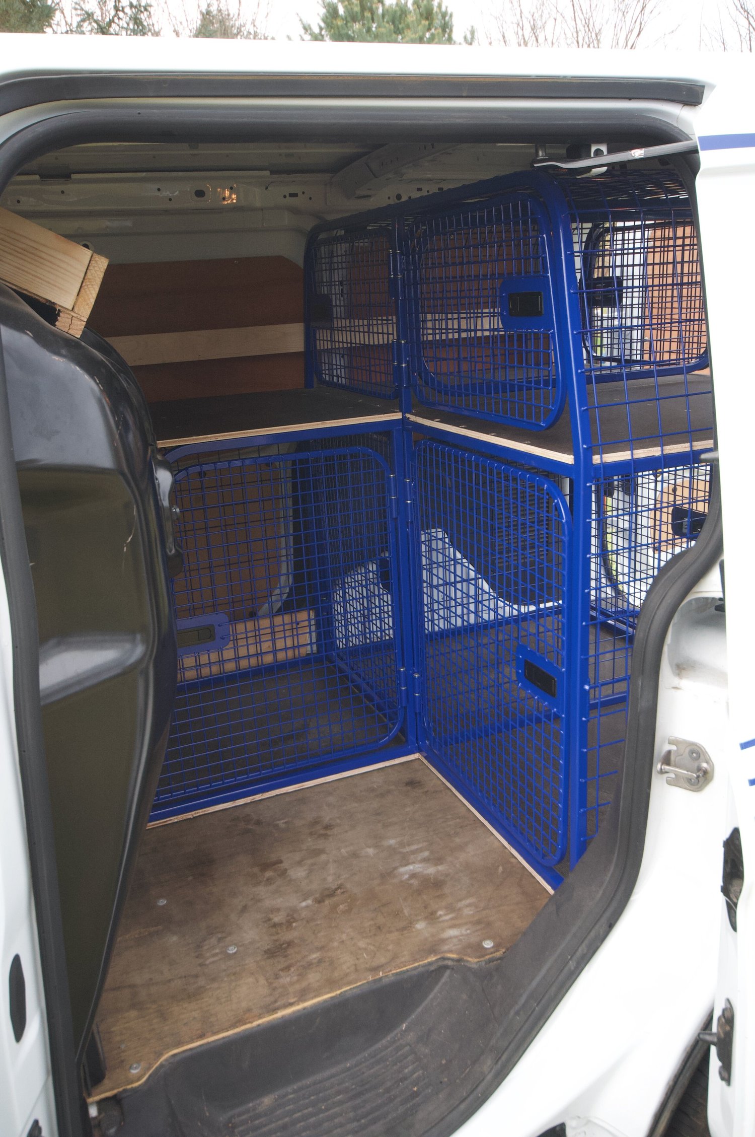 Cages made for a dog walker in a transit connect — Barras Blades