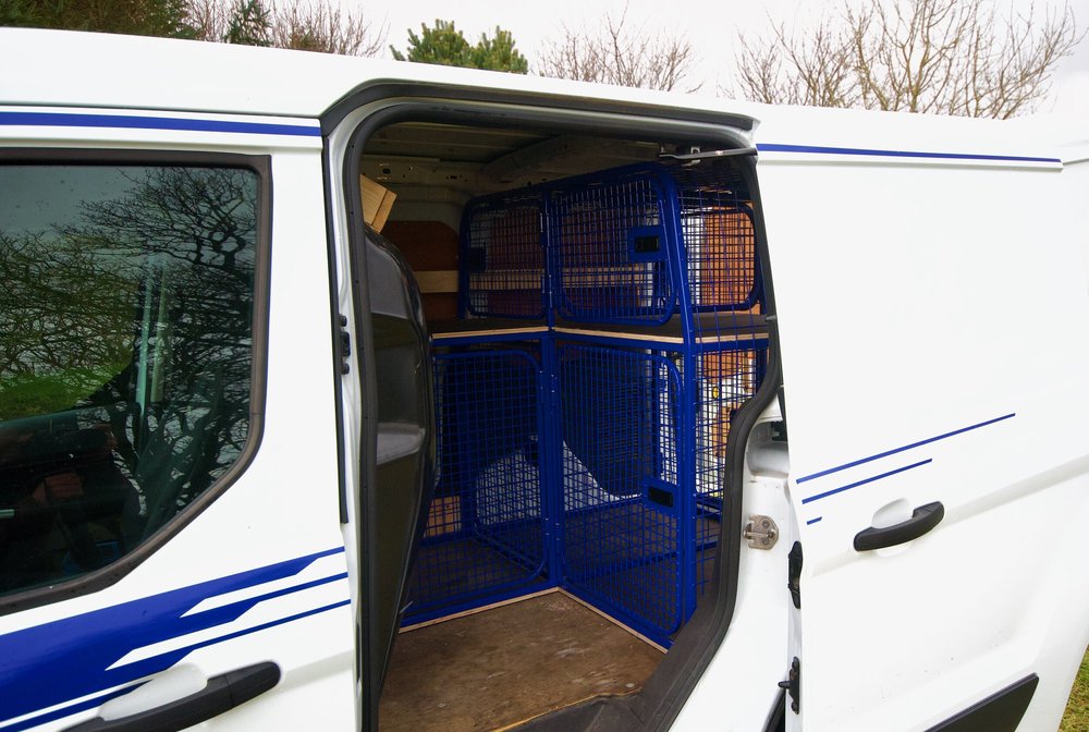 Cages made for a dog walker in a transit connect — Barras Blades