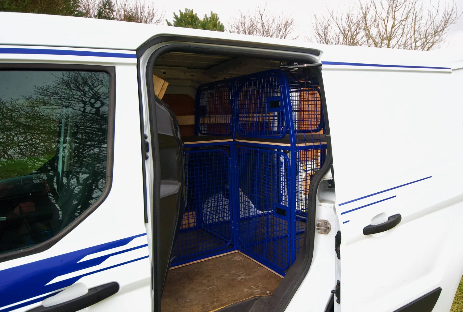 Cages made for a dog walker in a transit connect — Barras Blades