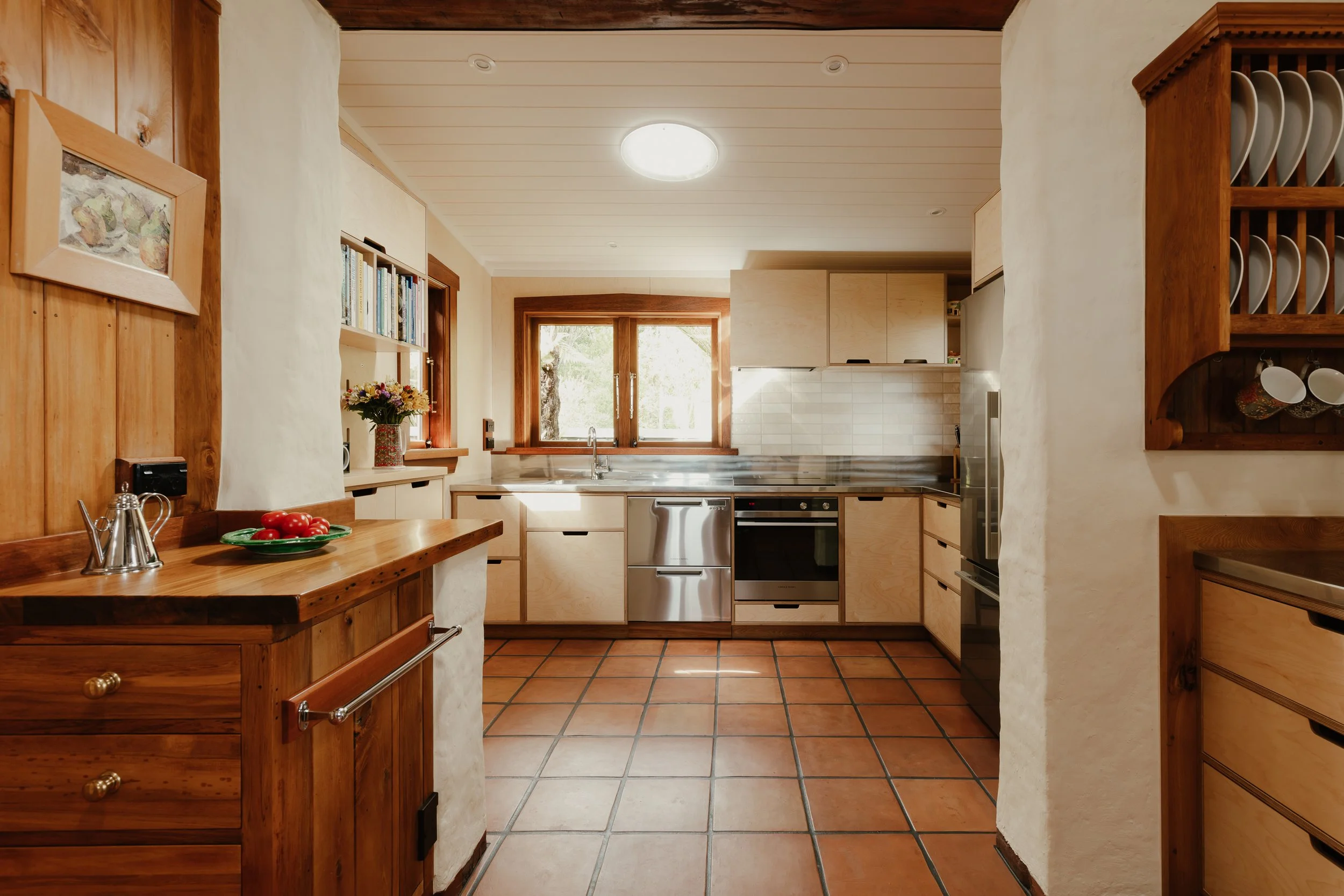 This beautiful adobe home combines Birch plywood and Native timber work ...