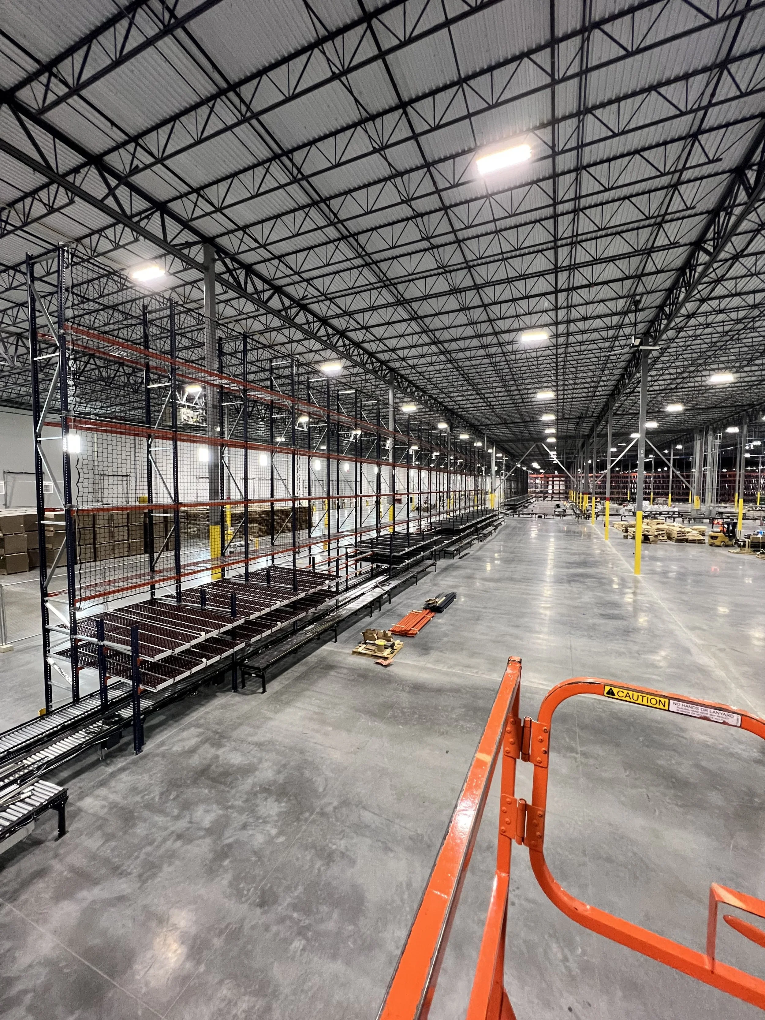 30' Rack with Carton Flow over Conveyor — GK Installs