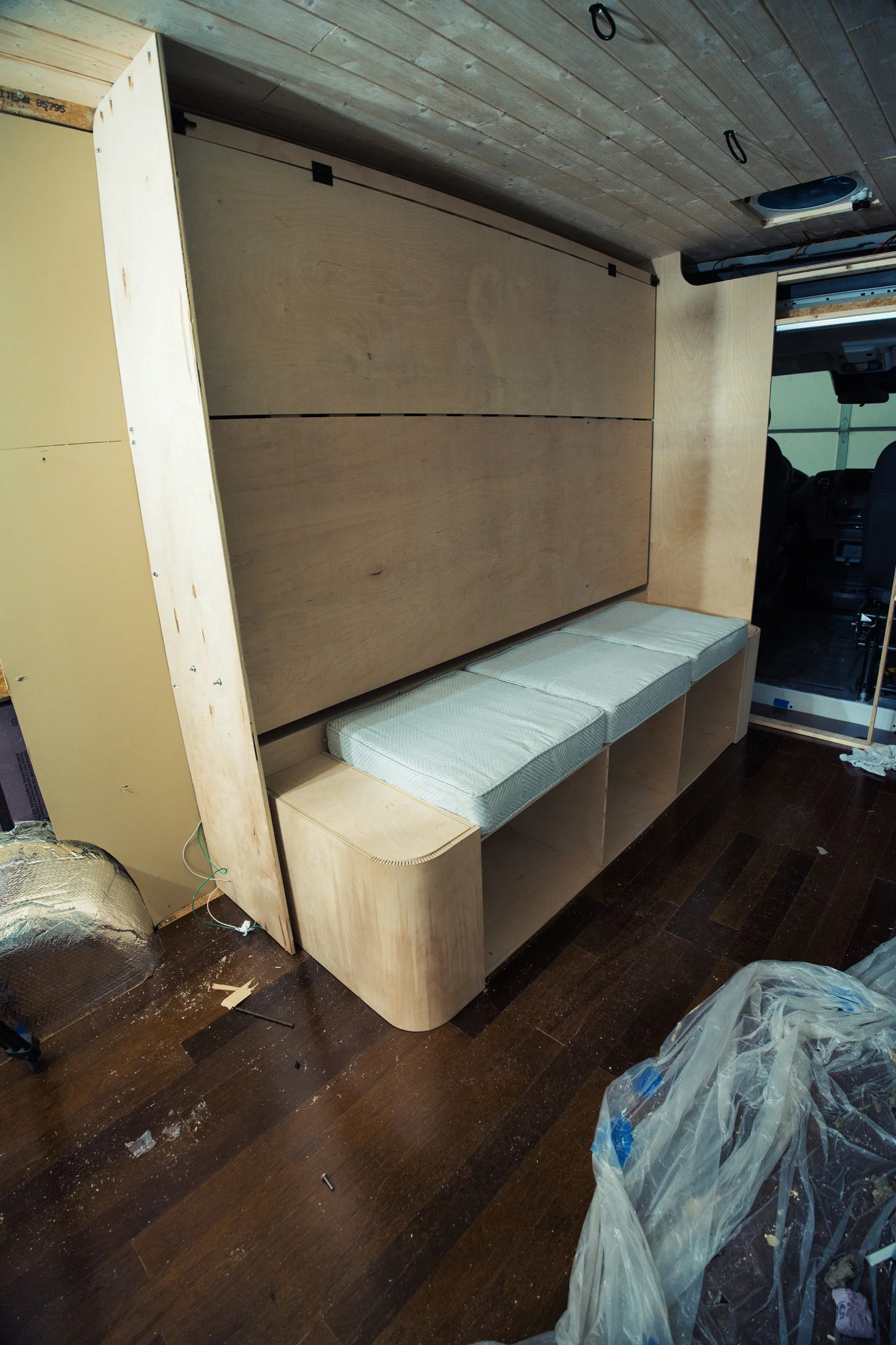 Van Murphy bed with Curved Bench seat storage — Dualex Builds