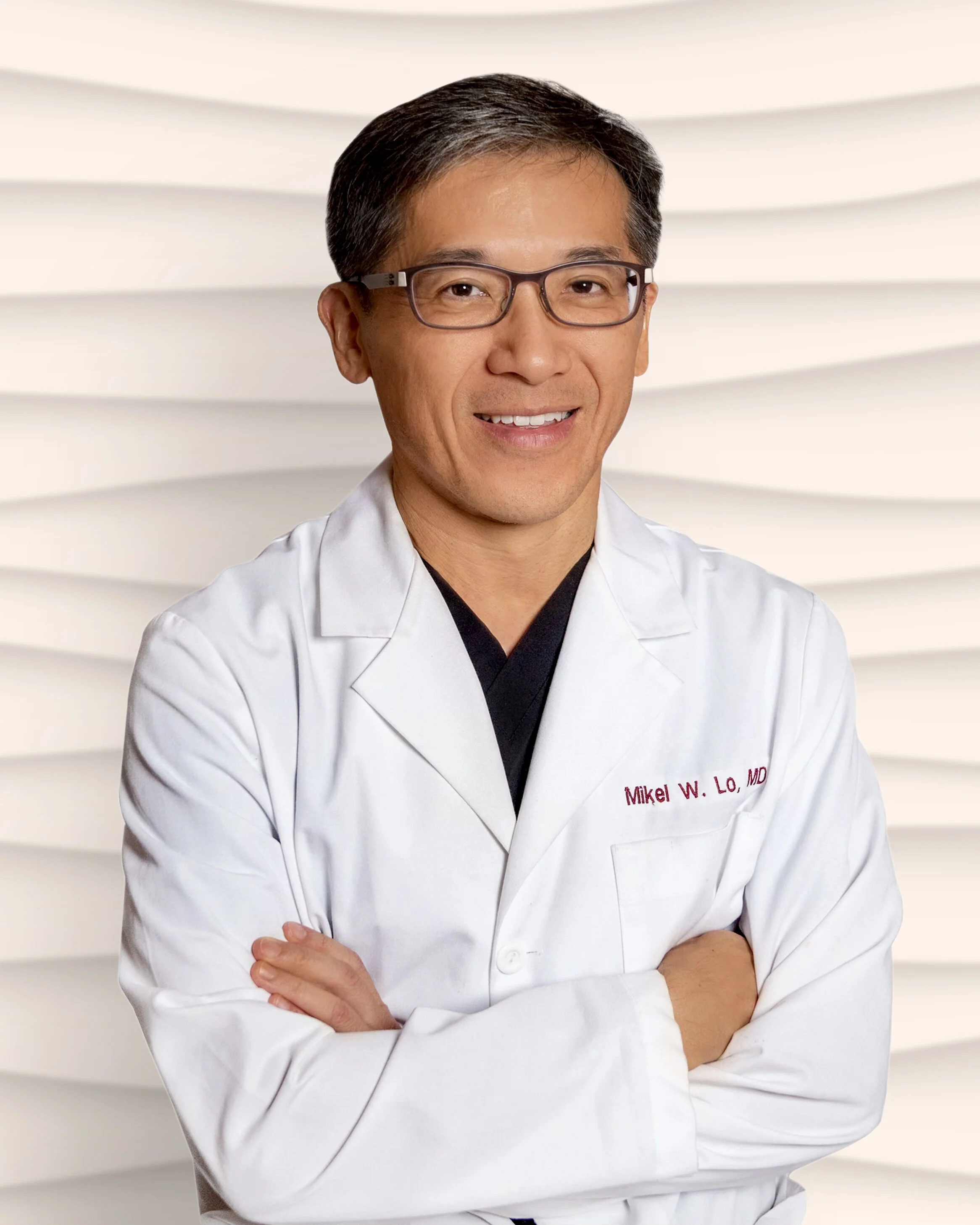 Dr. Mikel Lo — About Faces Cosmetic Surgery and Med Spa