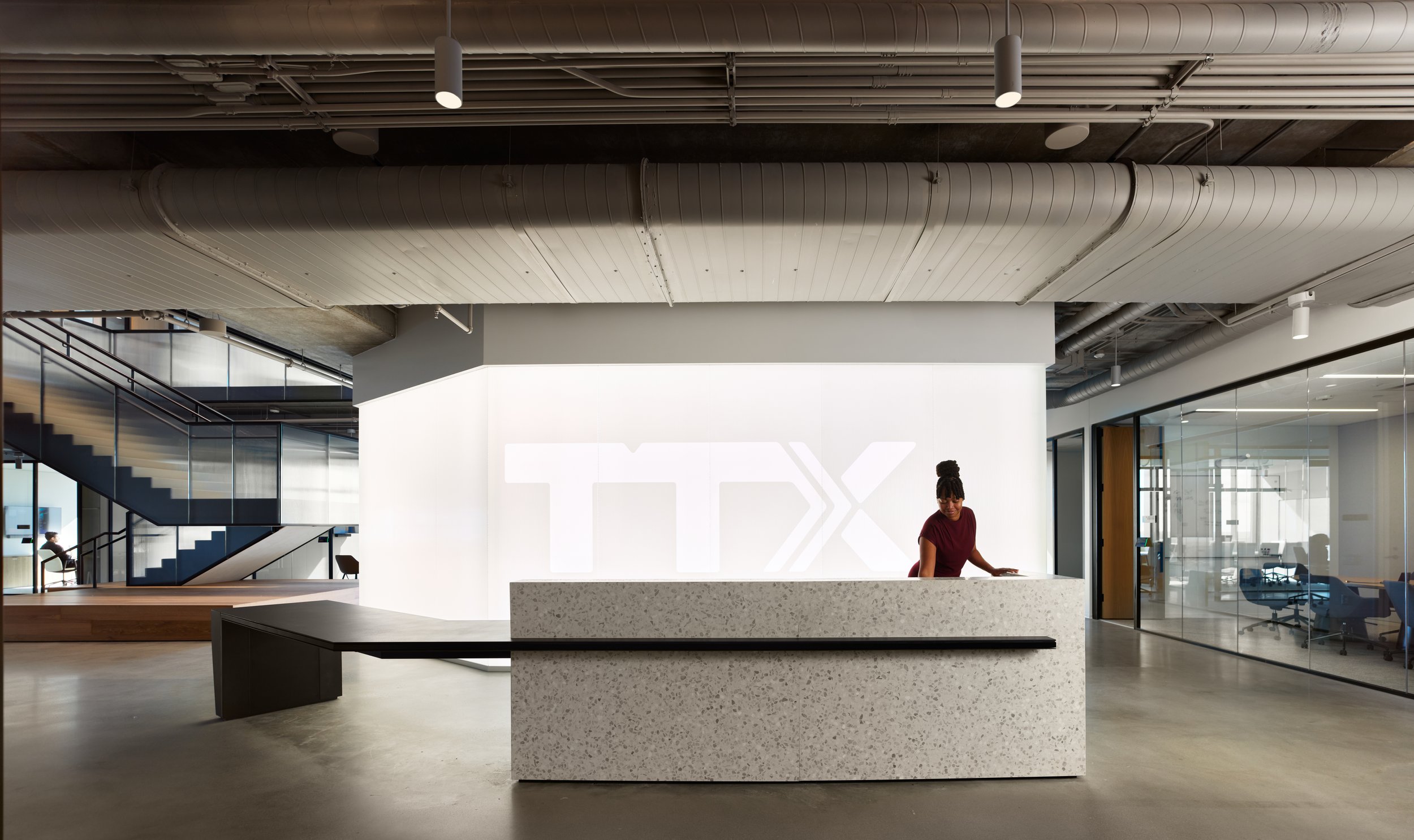 TTX — PMC Commercial Interiors