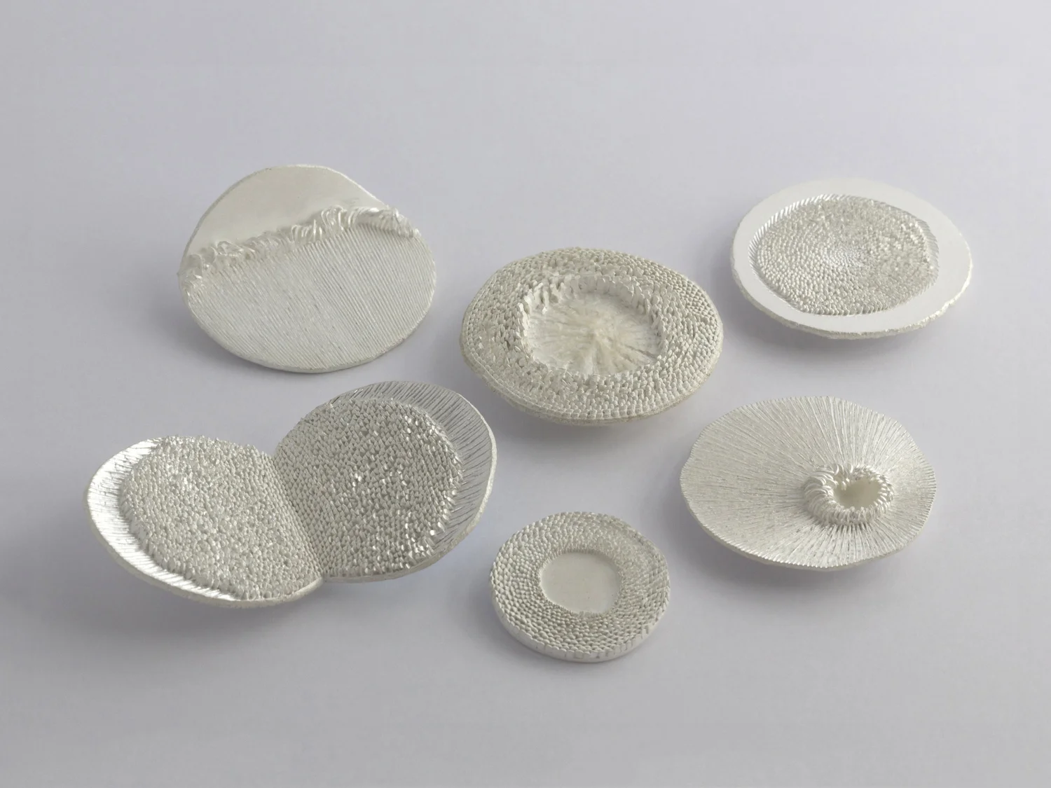 White Brooches — Emma Fielden
