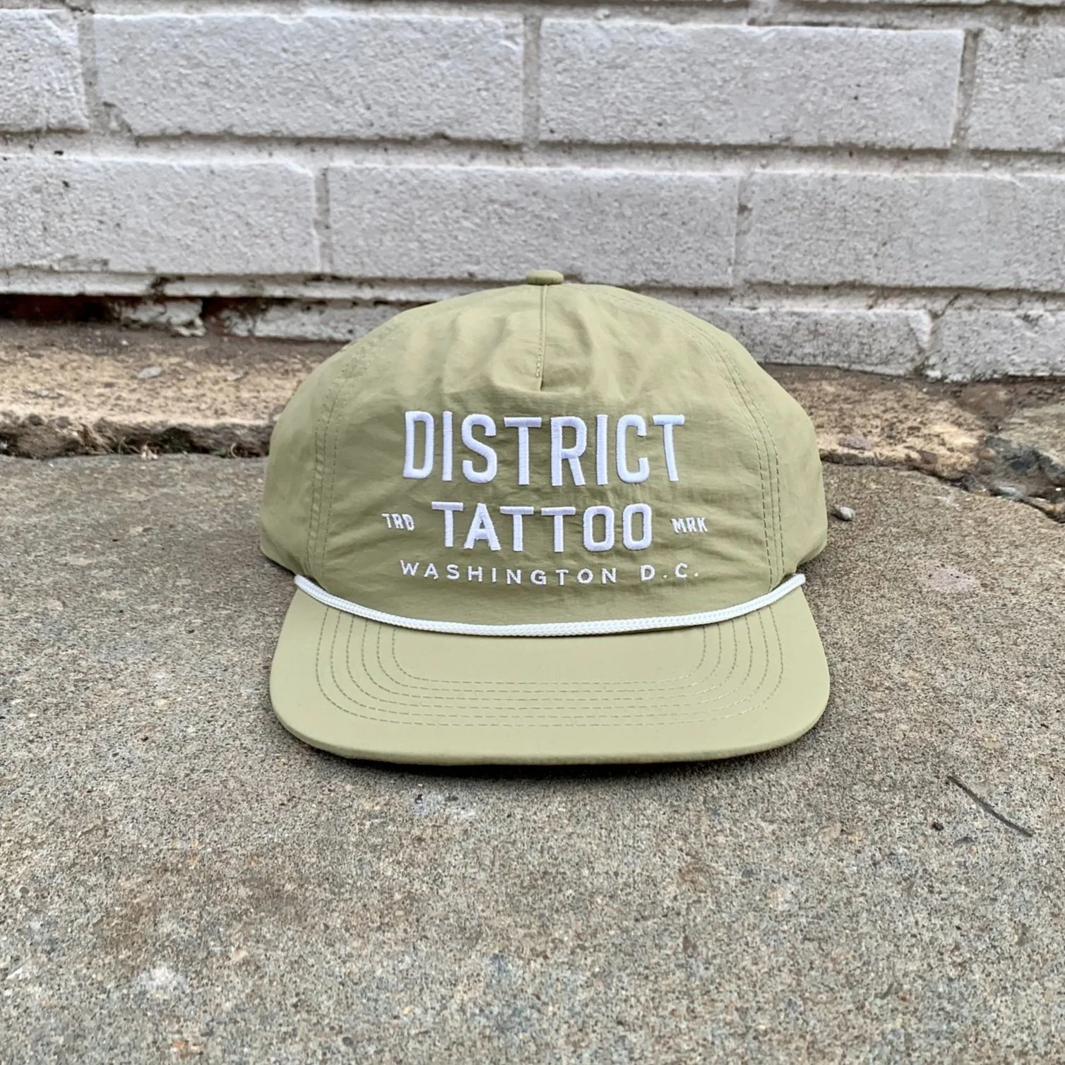 STORE — DISTRICT TATTOO CO