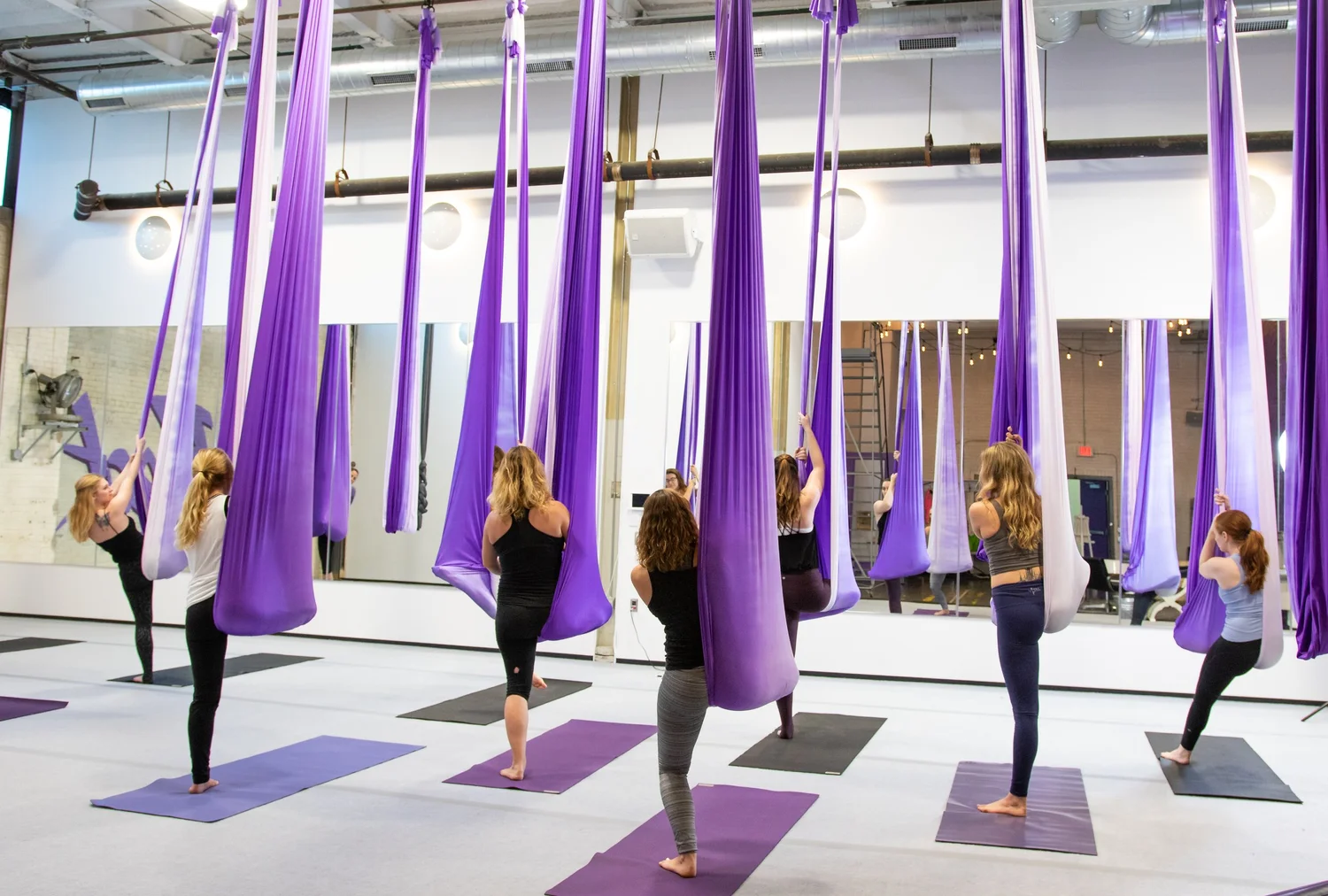 10 Benefits of Aerial Yoga — Fly Freak Studio