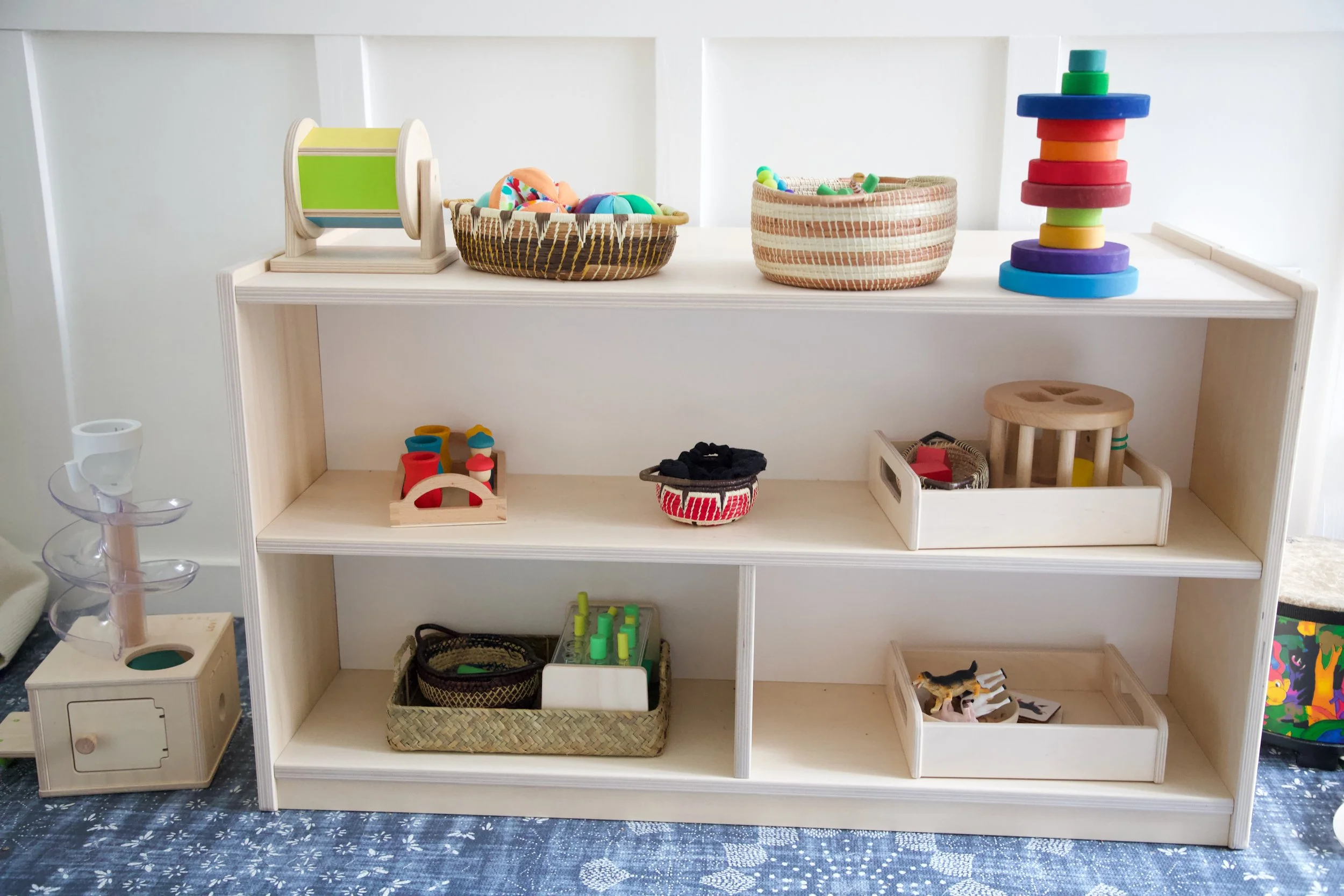 Our Montessori Shelf at 18 Months — Home and on the Way