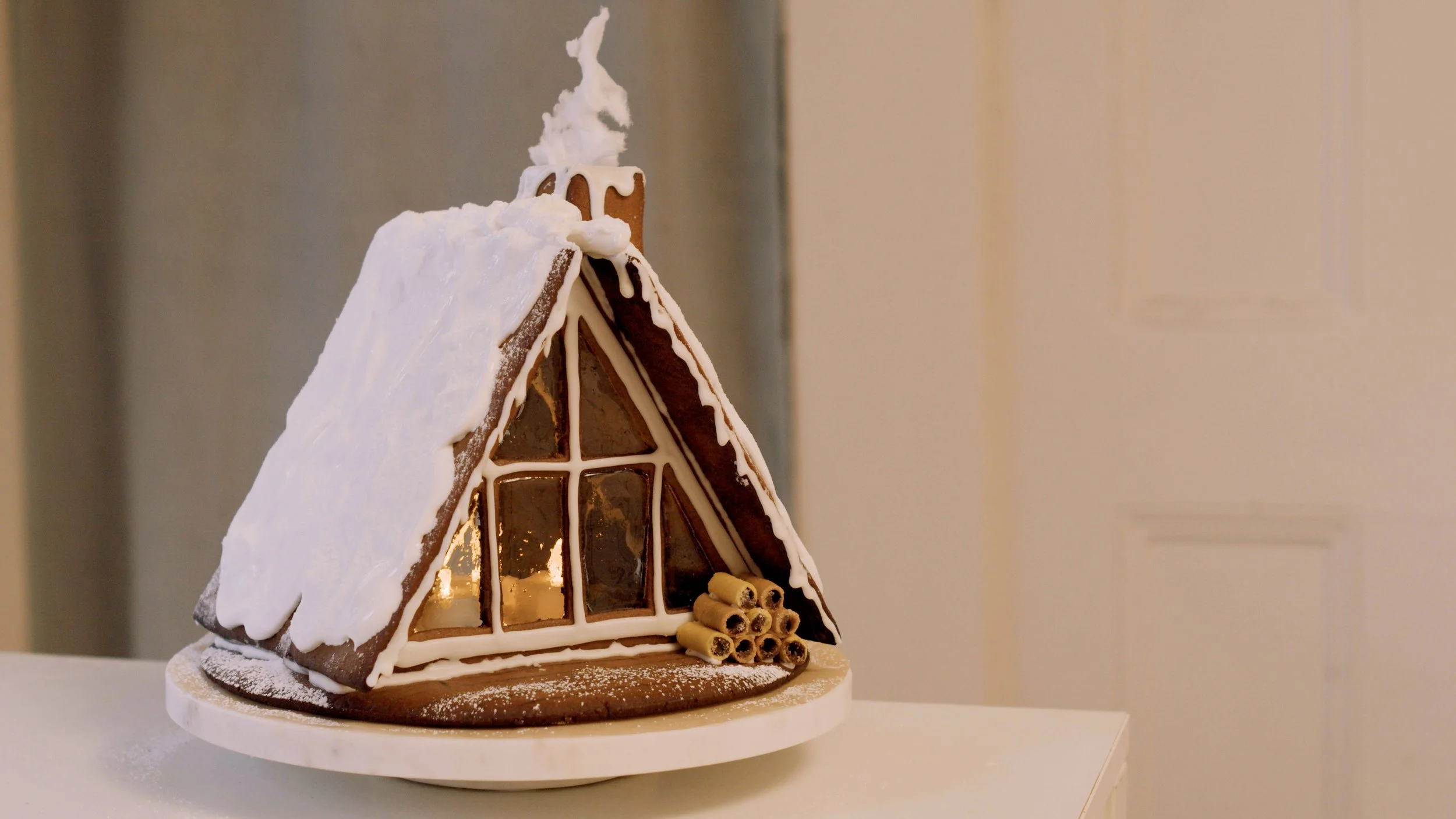 A (delicious) gingerbread A-frame cabin. — Amy Plante