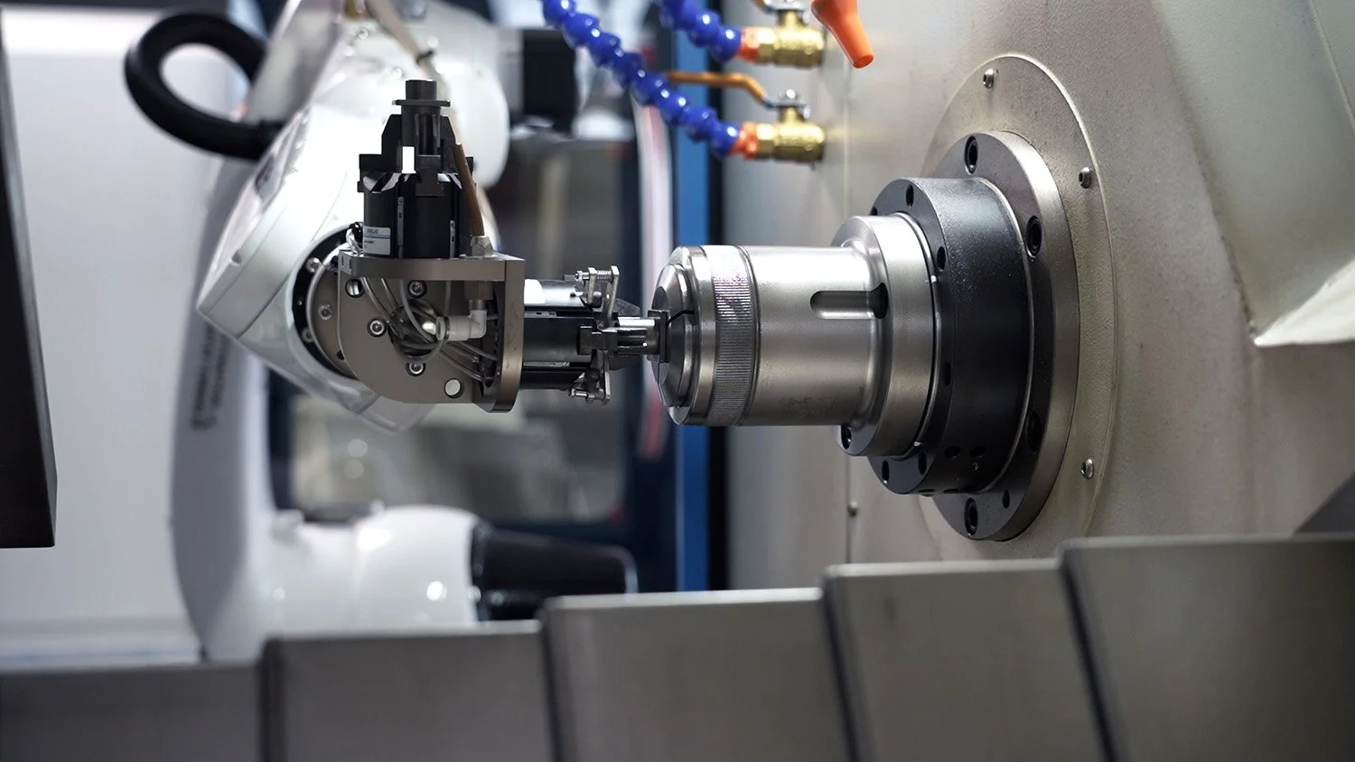 Application of Automated Robotic Arms in CNC Lathes