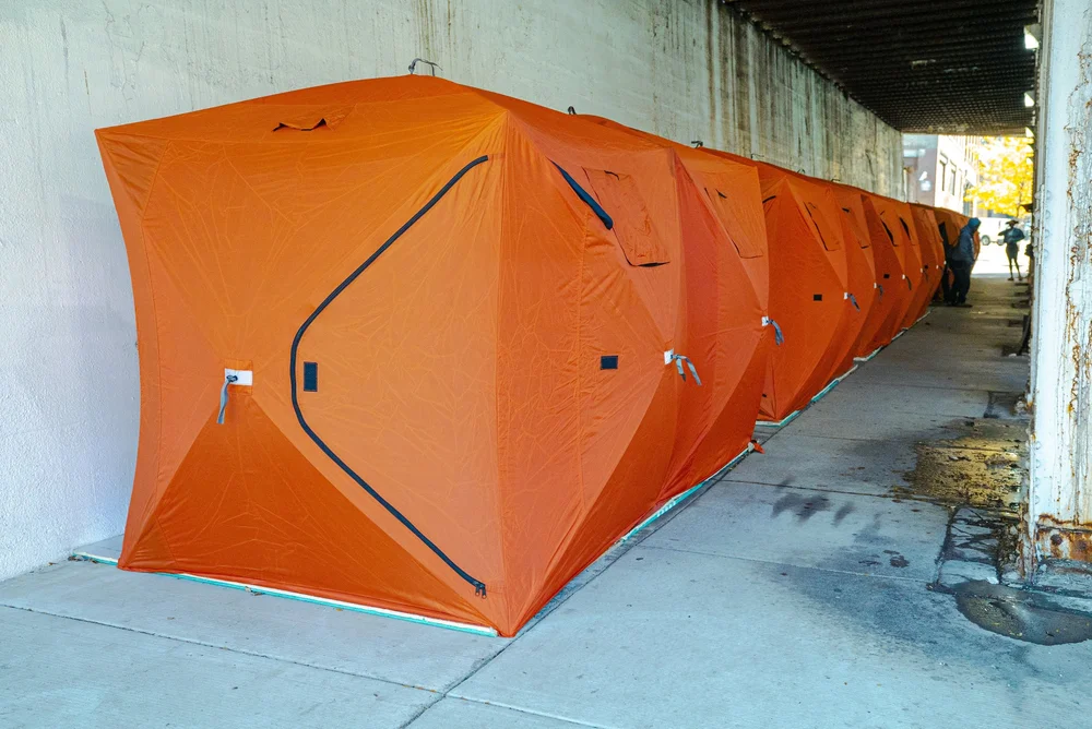 about — the orange tent project