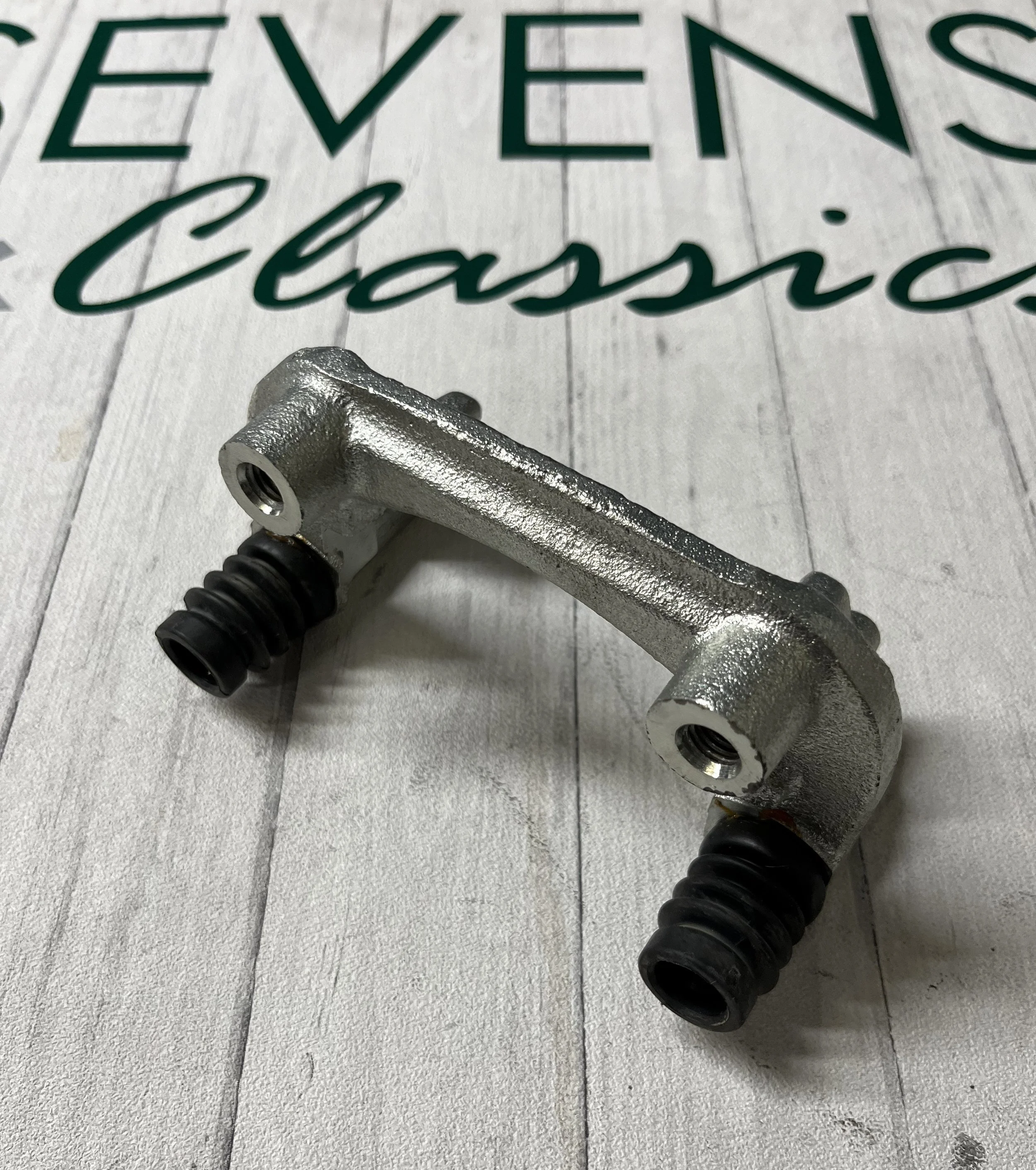 Rear Brake Caliper Carrier — Sevens & Classics