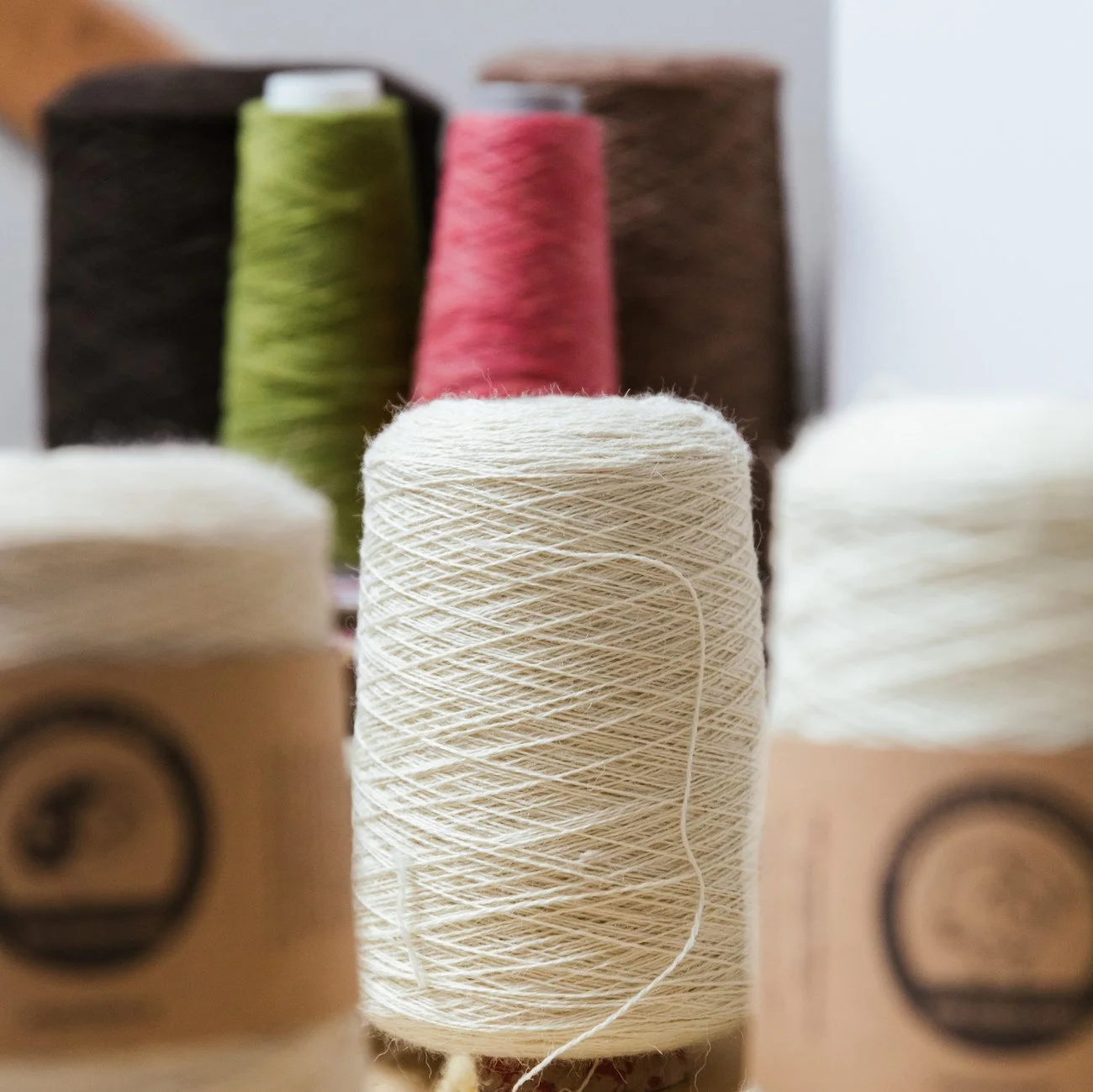Where can I find the best coned yarn for my knitting machine?