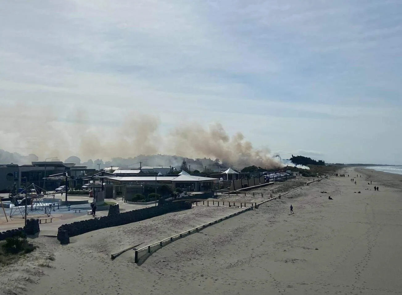 Christchurch Road blocked off as fire crews put out sand dune fire ...