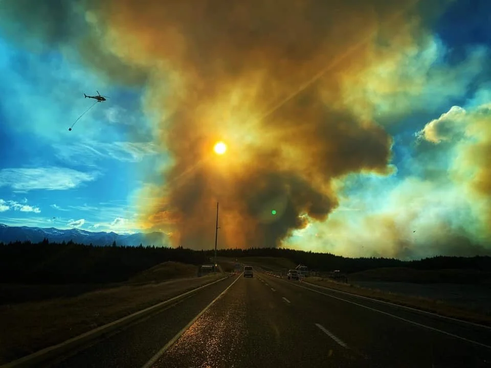 14 helicopters battling massive Mackenzie fire, houses evacuated ...