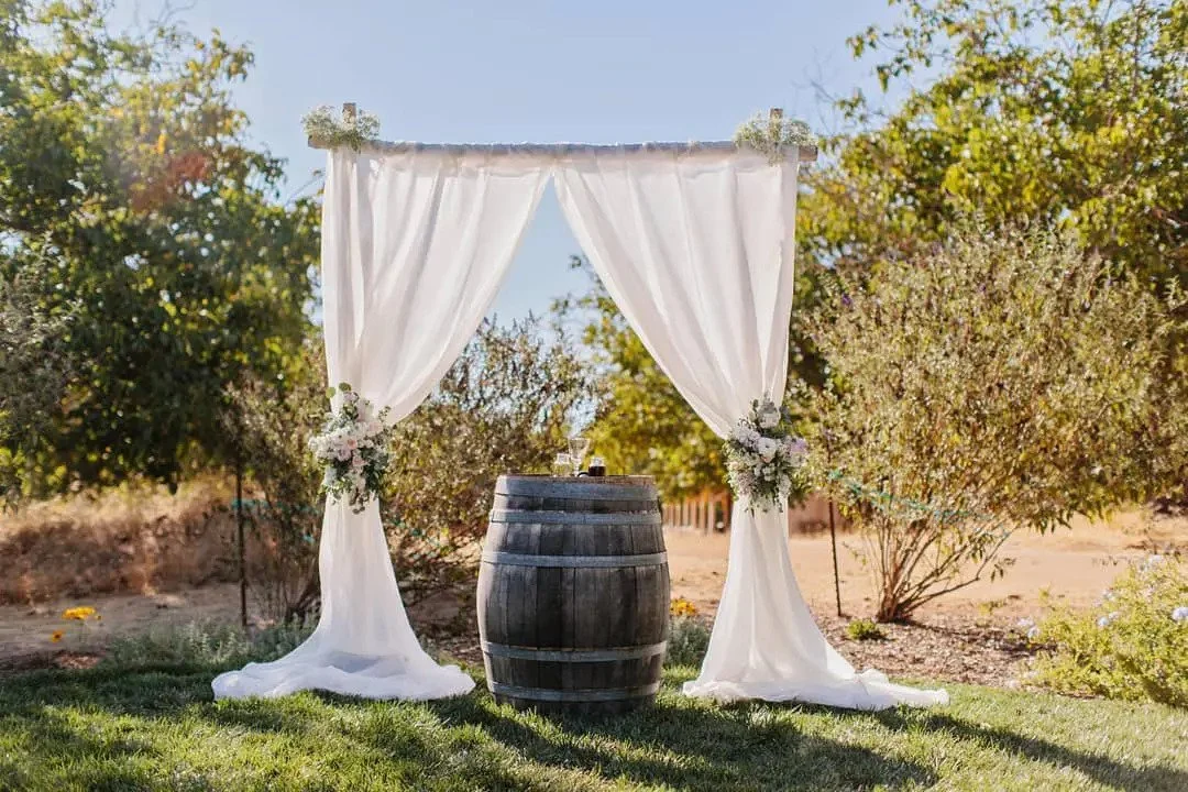 How to Decorate a Wedding Arch With Fabric (With Ideas)
