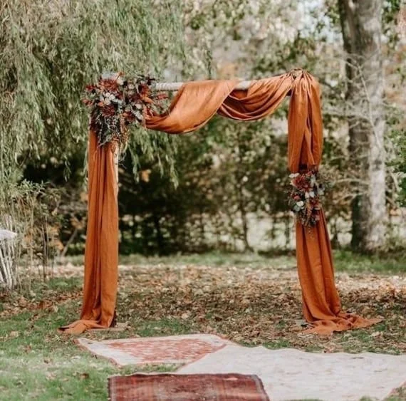 How to Decorate a Wedding Arch With Fabric (With Ideas)
