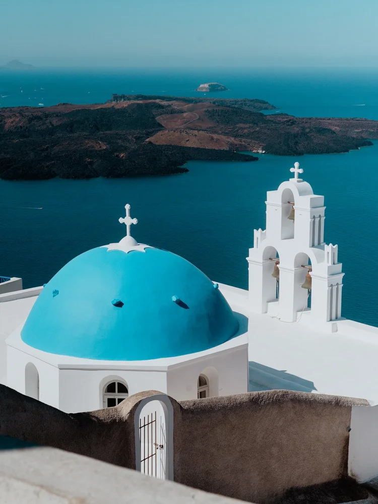 Where are the blue domes in Santorini — somewhere waits