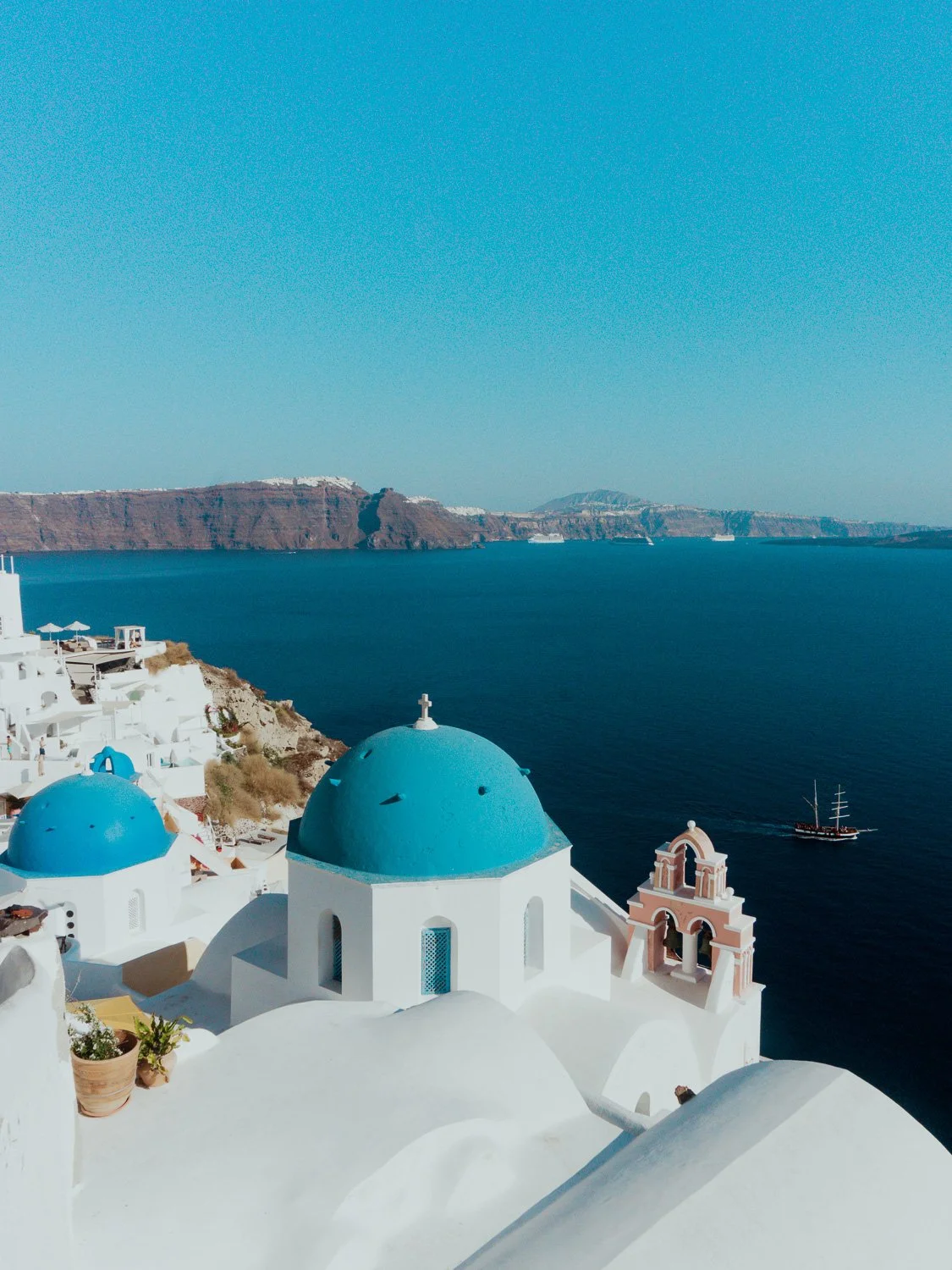 Where are the blue domes in Santorini — somewhere waits