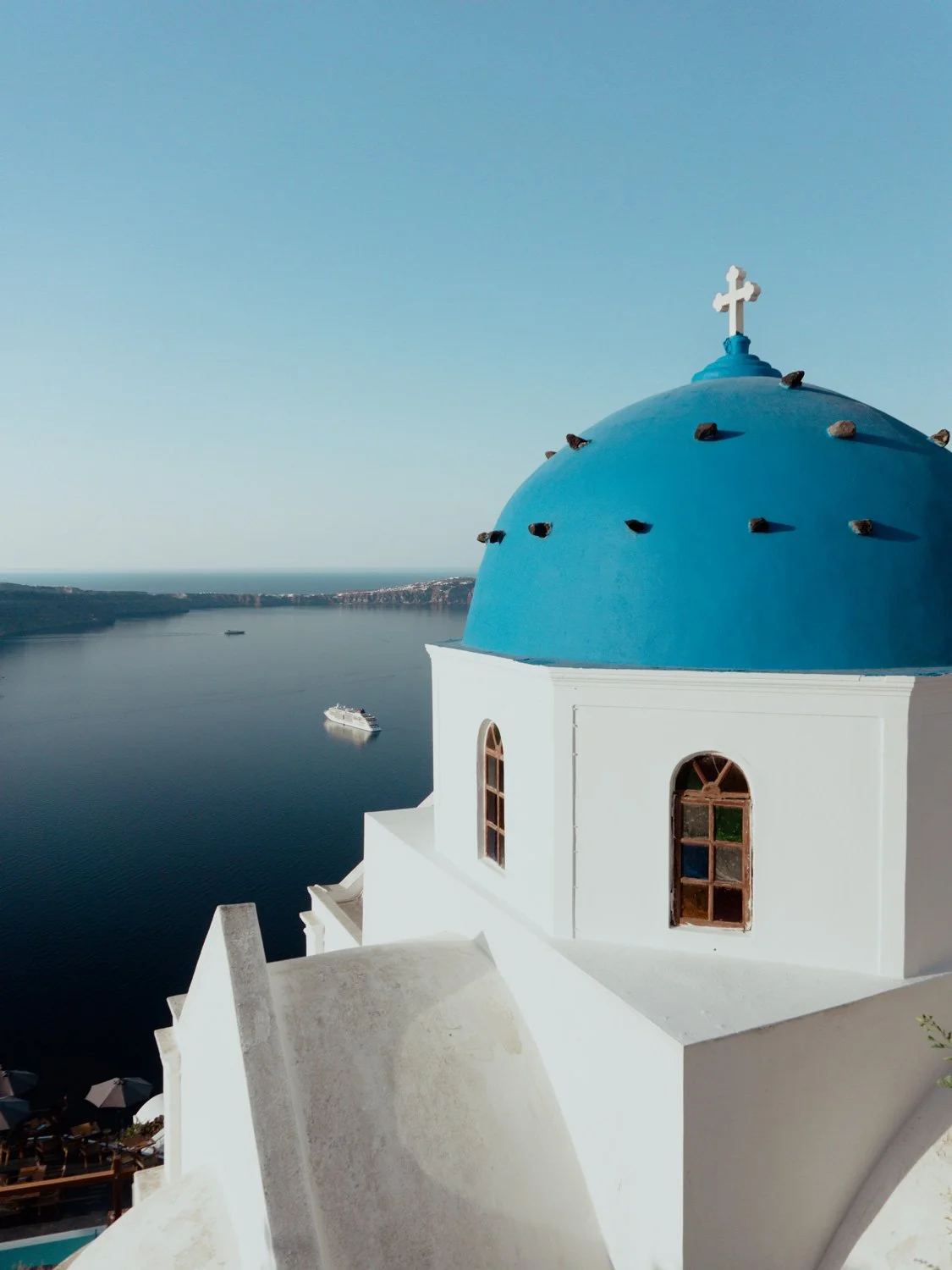 Where are the blue domes in Santorini — somewhere waits