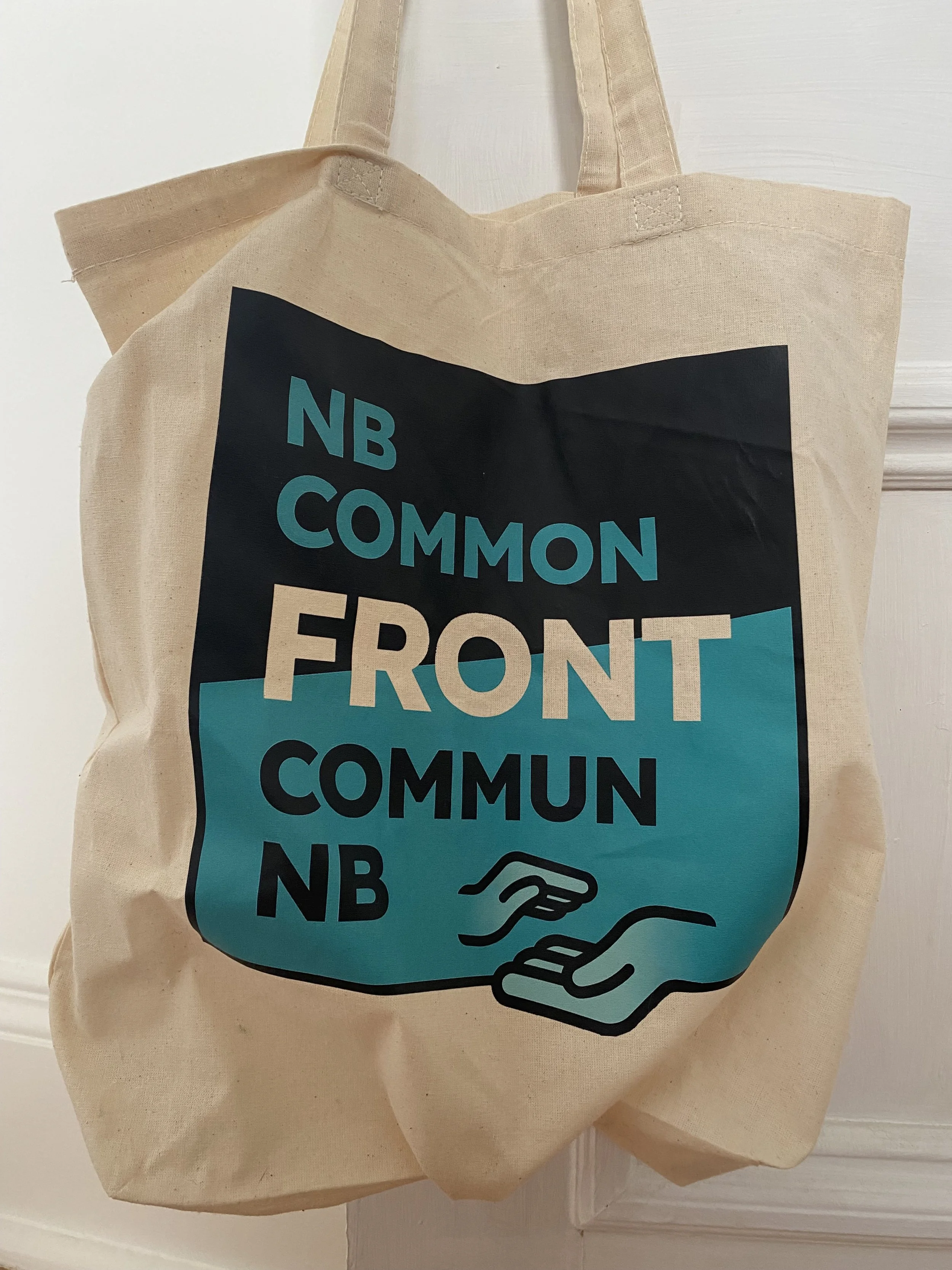 MERCH — NB Common Front commun NB