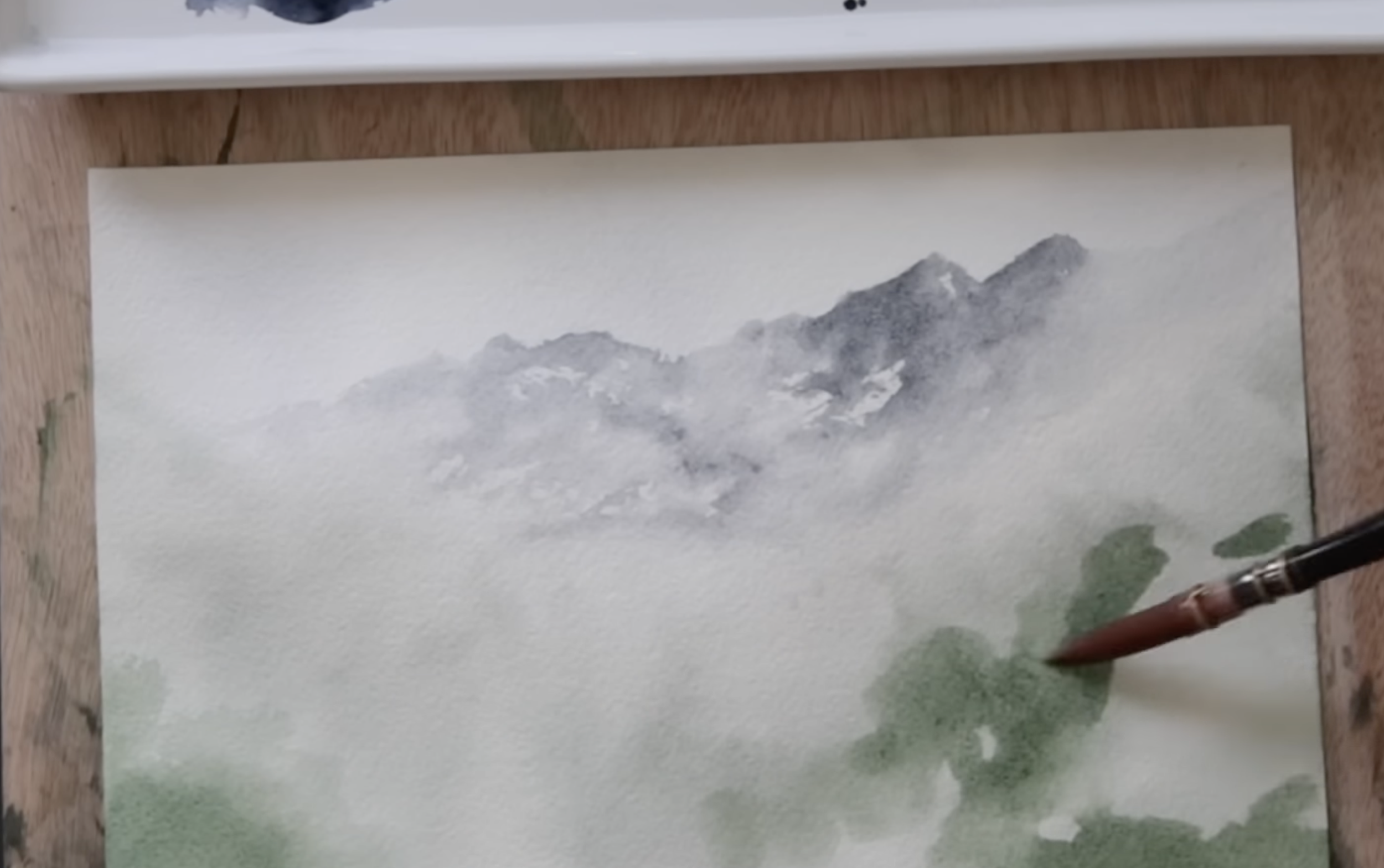 Learn how to paint a misty mountain and forest in watercolor with this ...