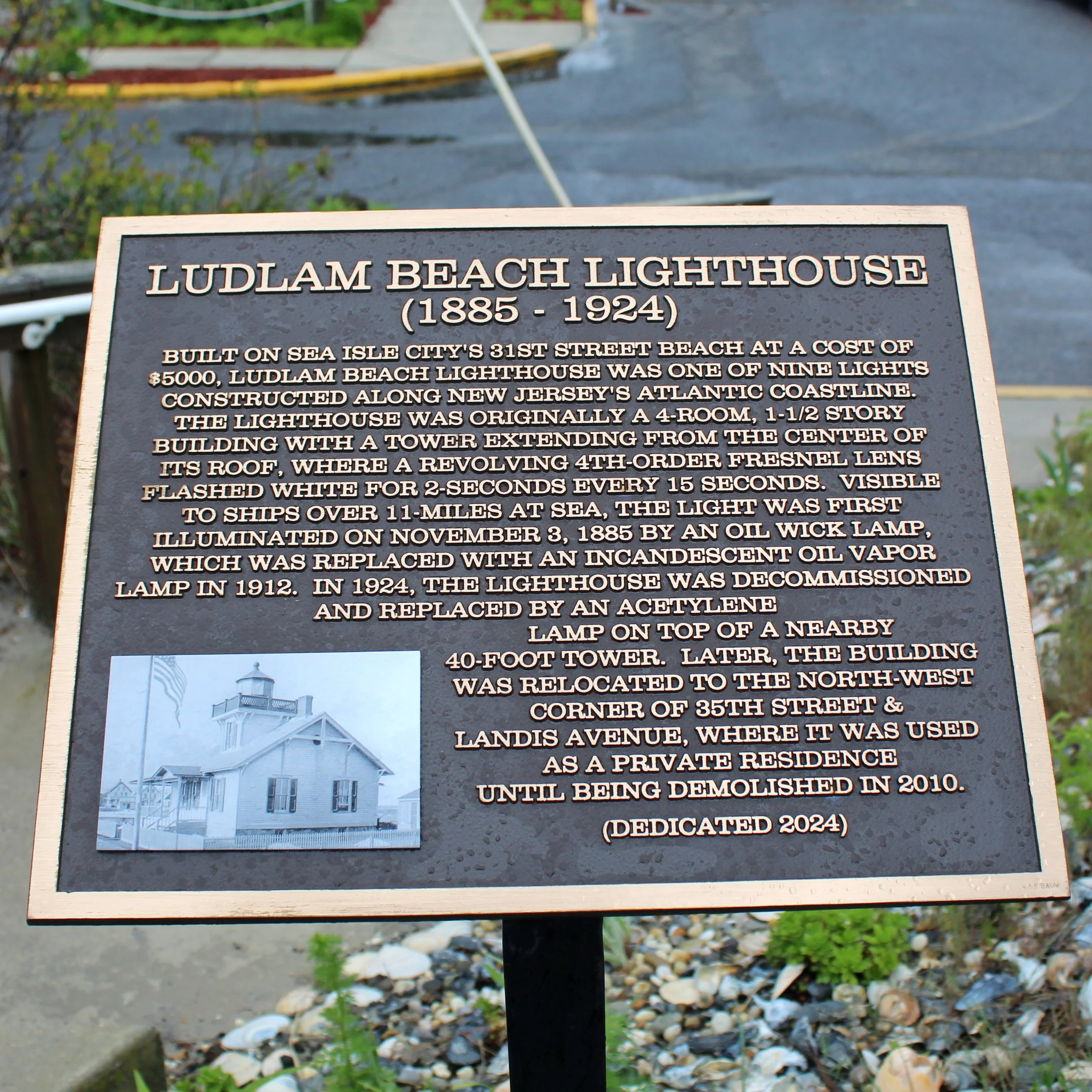 A bronze plaque commemorating the Ludlam Beach Lighthouse was unveiled ...
