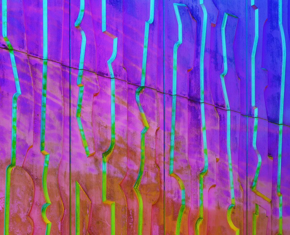 Concrete murals and reliefs photographed at night in a colourful style ...