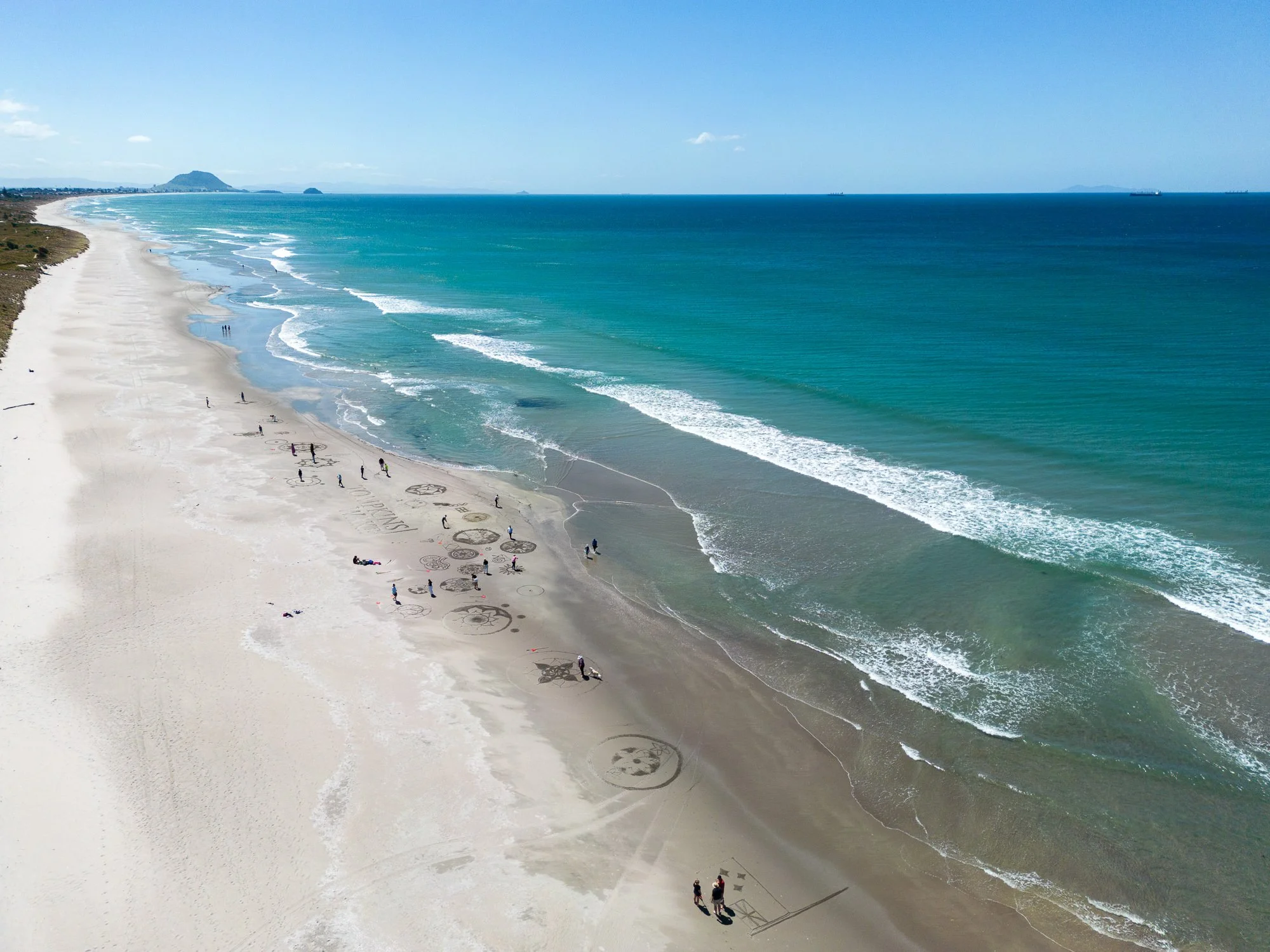 Tompkins Wake Team Building — Rake Healing - New Zealand Sand Artist