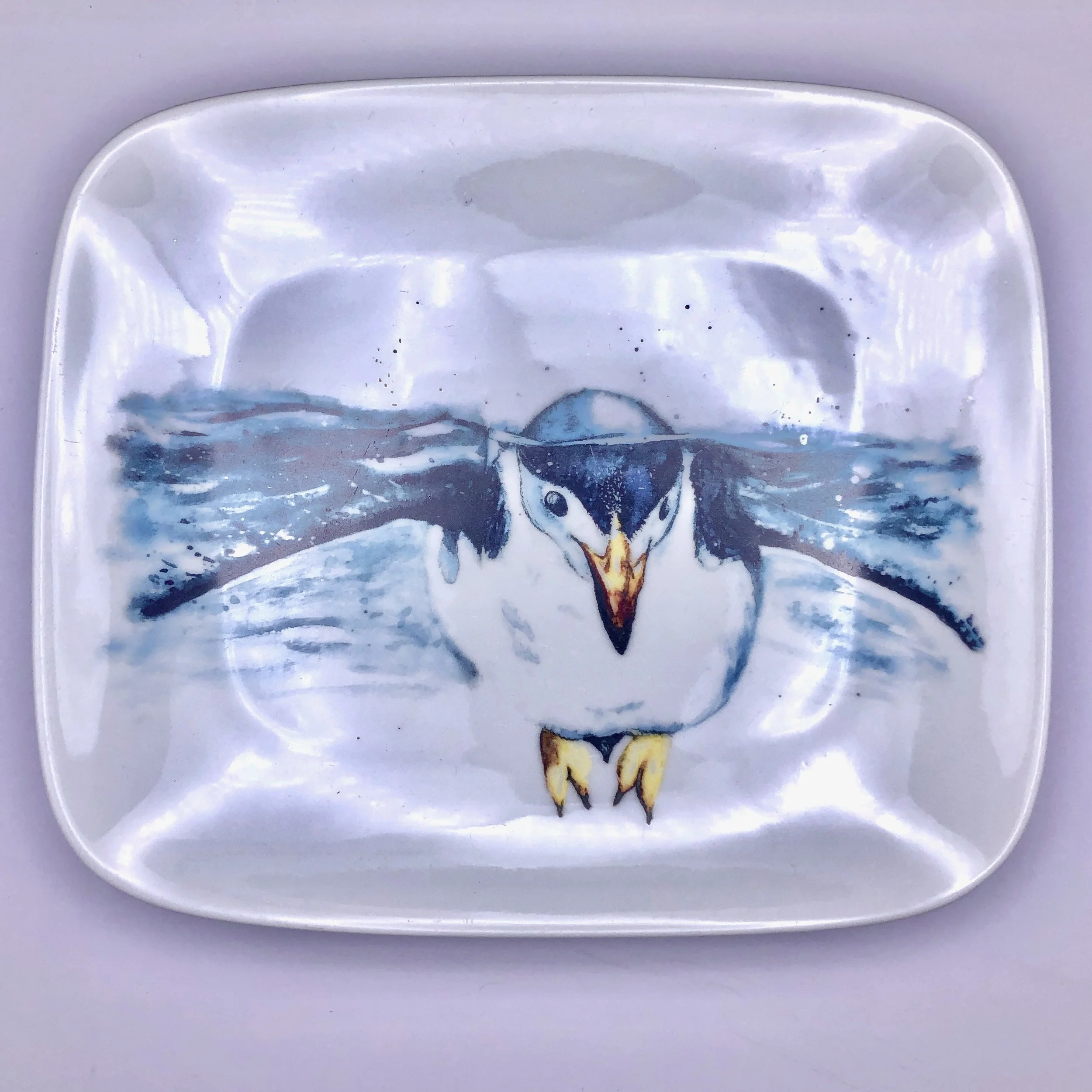 Swimming penguin upcycled plate — The Jolly Upcycler