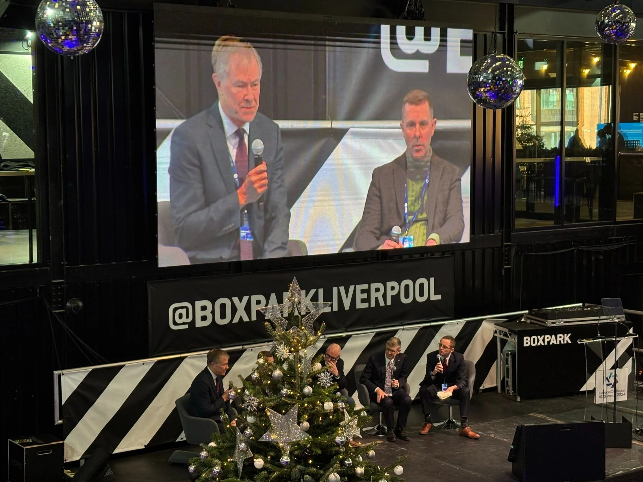 AI Sight at the Liverpool AI Summit - Professor Simon Harding on stage ...