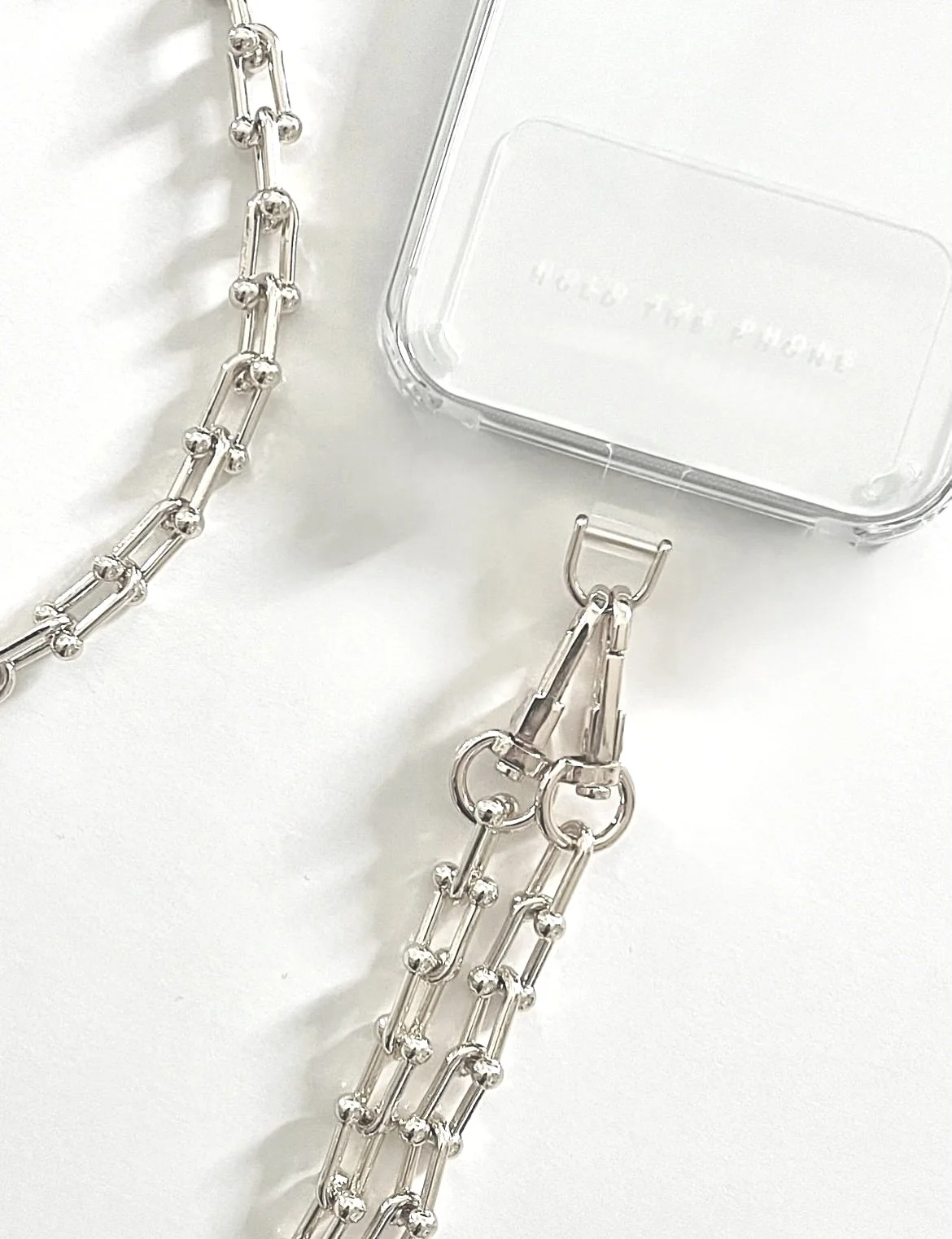 Phone cords, chains and cases for iPhone and Android — HOLD THE PHONE