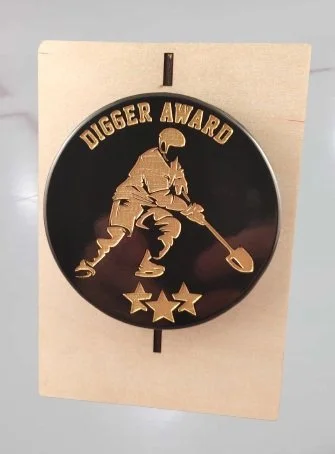 VCL Products - Digger Award Hockey Pucks — Victoria Custom Laser