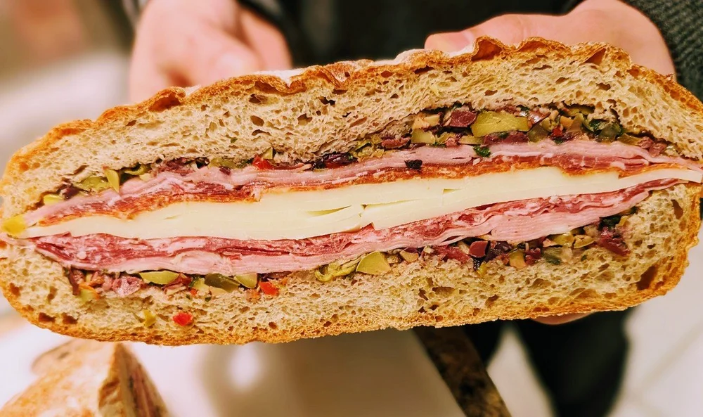 Authentic Muffaletta Sandwich with Homemade Olive Salad Recipe — One ...