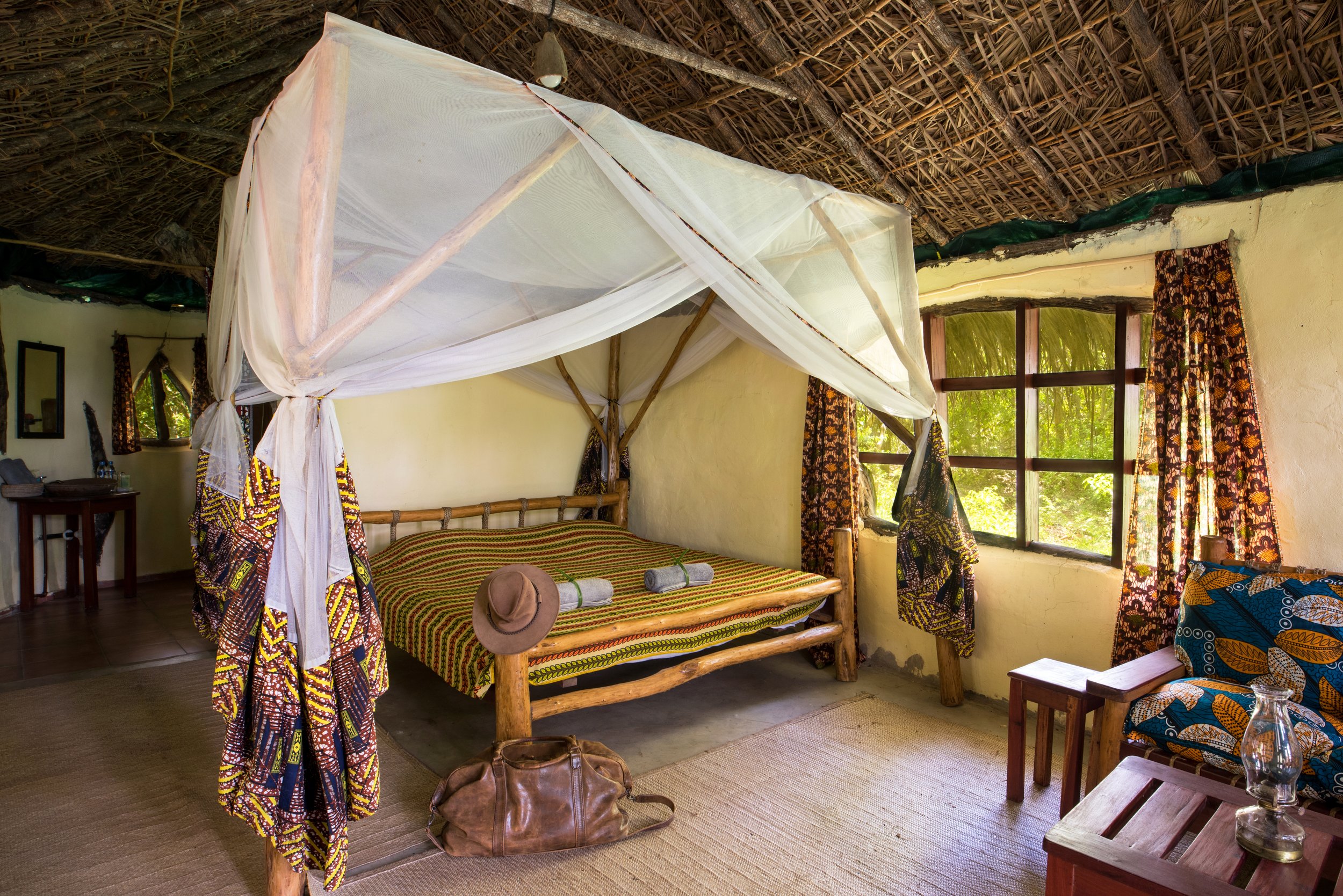 Selous Accommodation: Mudhut Rooms — Selous River Camp
