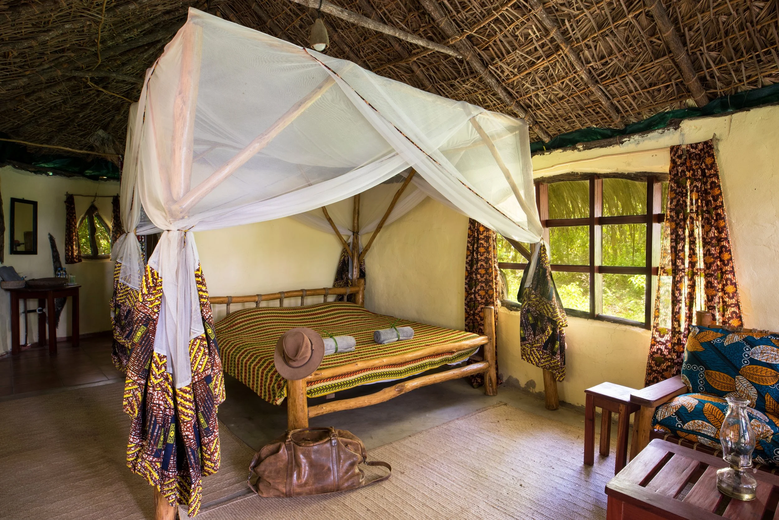 Selous Accommodation: Mudhut Rooms — Selous River Camp