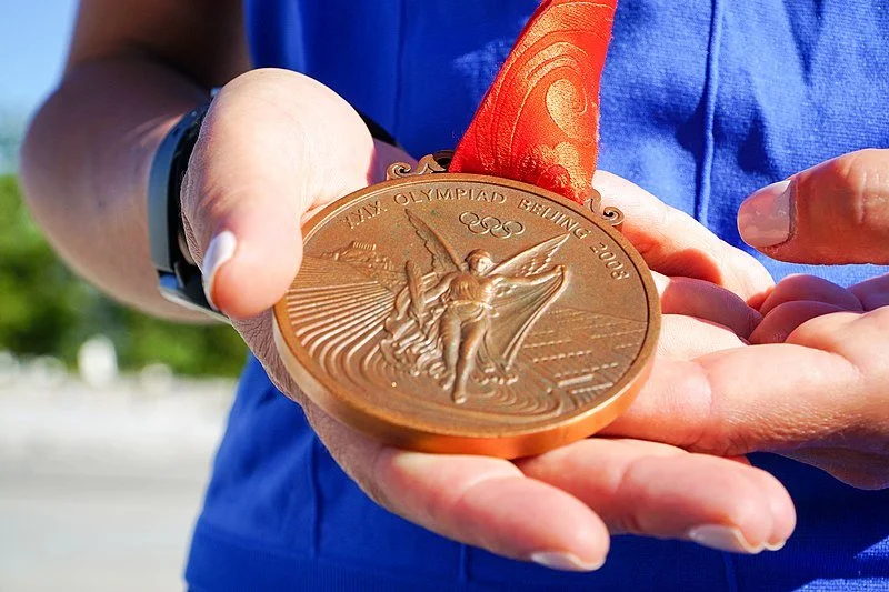 Tarnished Olympic Medals & Grief - Check Your Compass