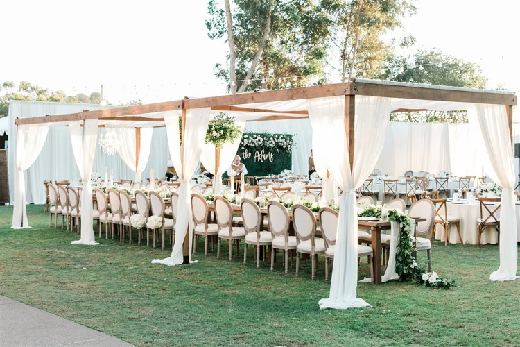 brown wood cabana setup with drapes for weddings and corporate events ...