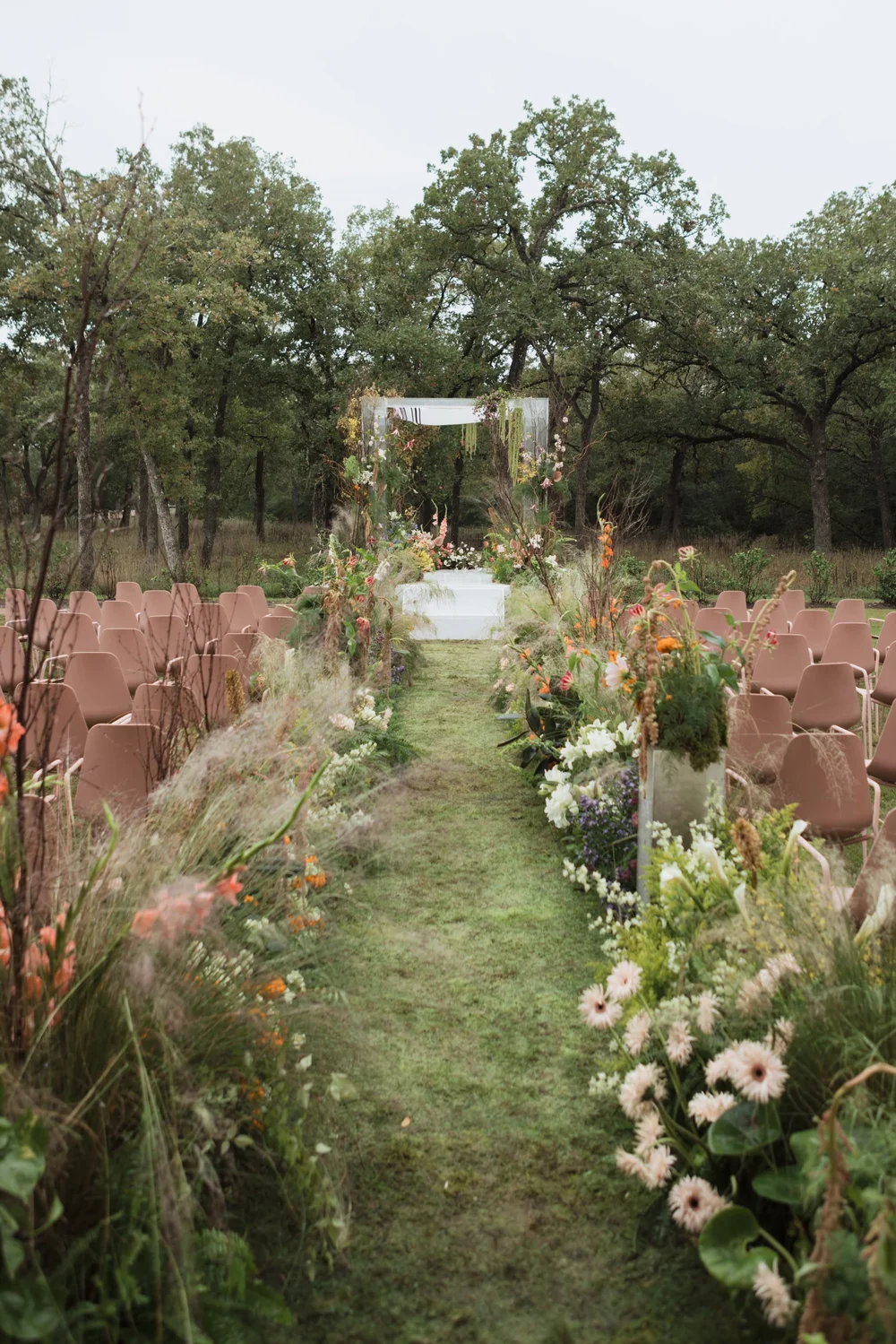 Overgrown Ceremony Aisle Flowers inspired by Alice in Wonderland