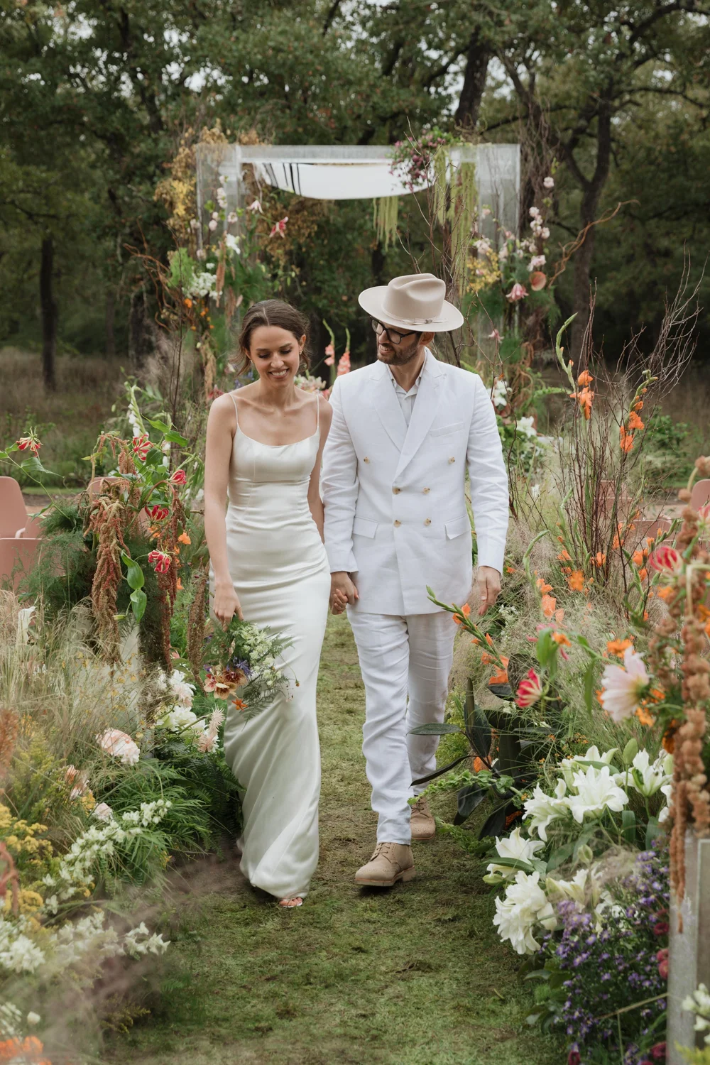 Overgrown Ceremony Aisle Flowers inspired by Alice in Wonderland