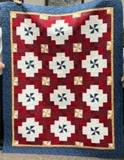 About 1 — CALICO CAPERS QUILT GUILD