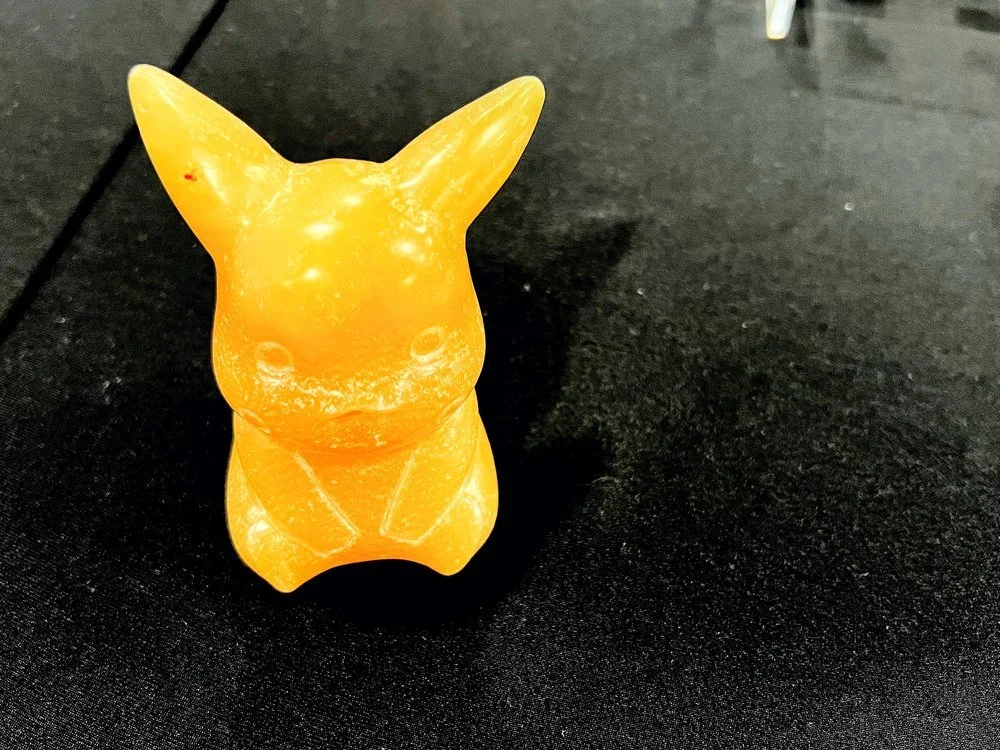 Orange calcite pikachu — Mystic Healing Stones