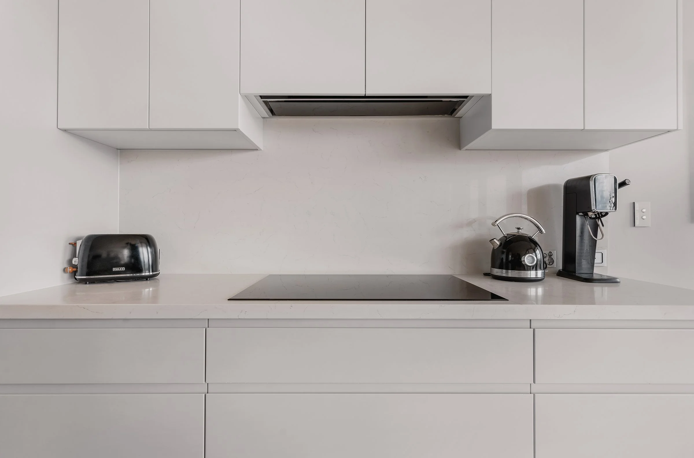 Modern Minimal Kitchen with white cabinetry and Kitchen Island with ...