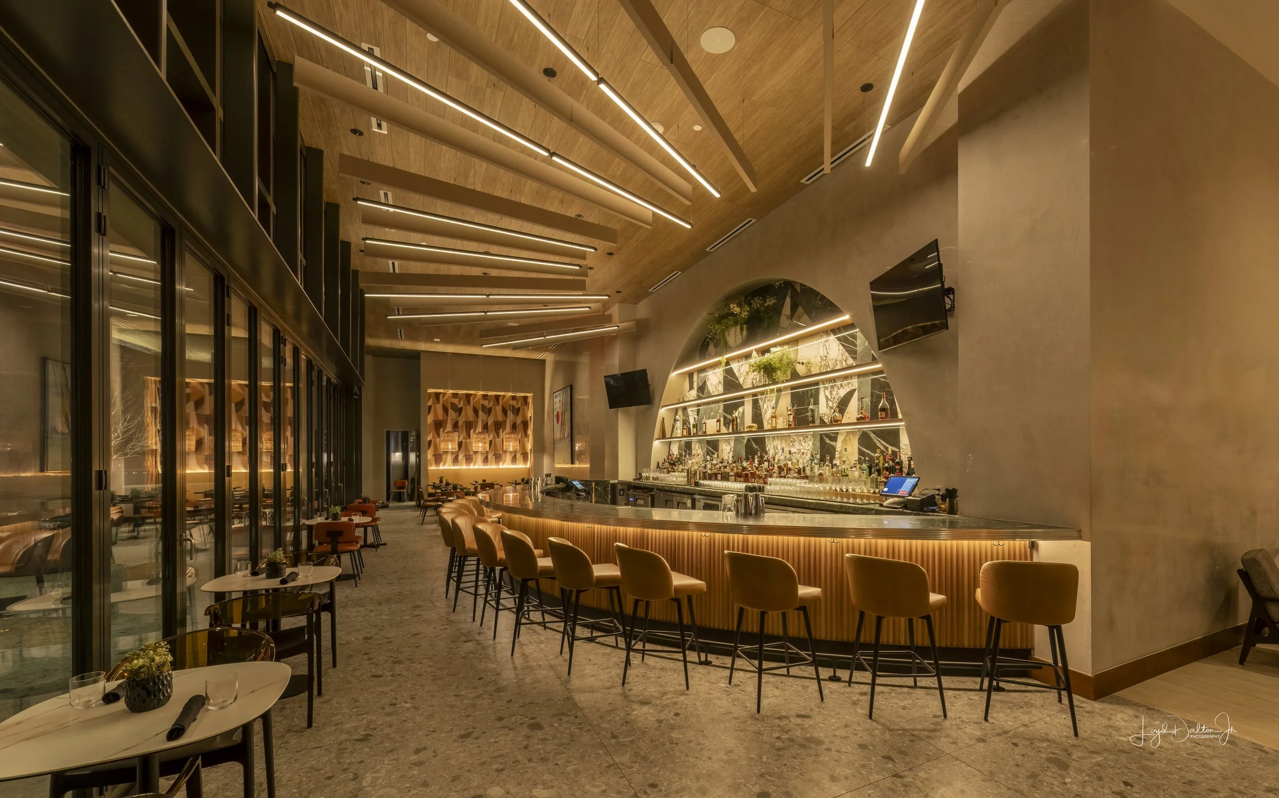 Modern American Restaurant on open air deck with views of Downtown Houston
