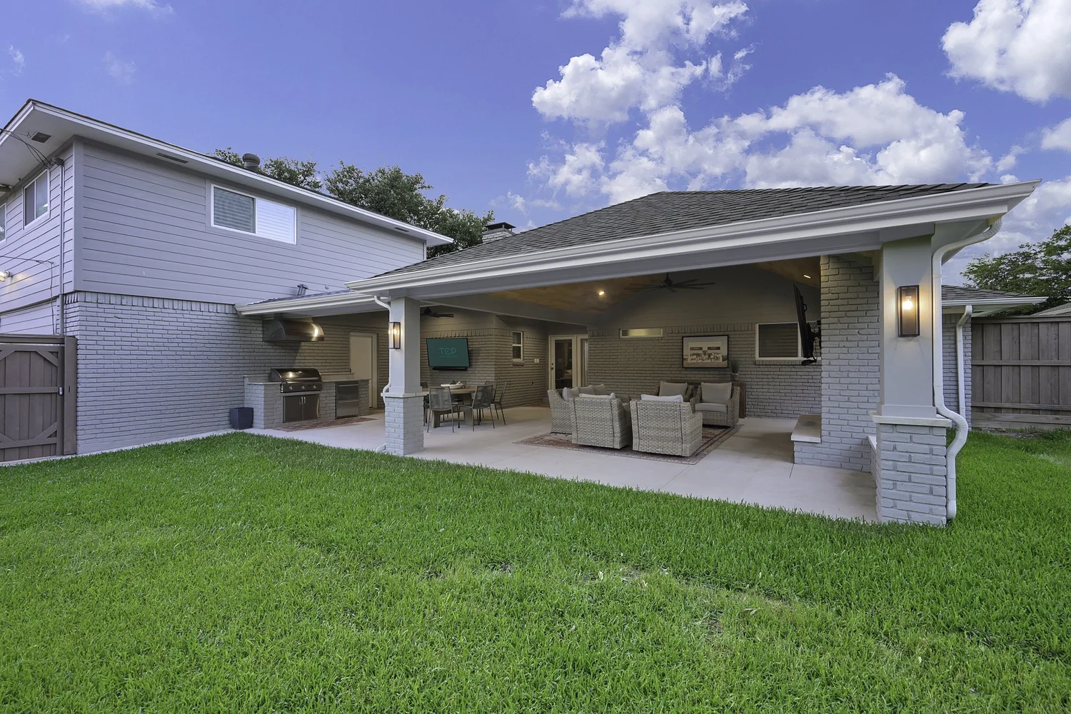 Custom Patio Cover with Outdoor Kitchen and Fireplace in Dallas by TCP ...