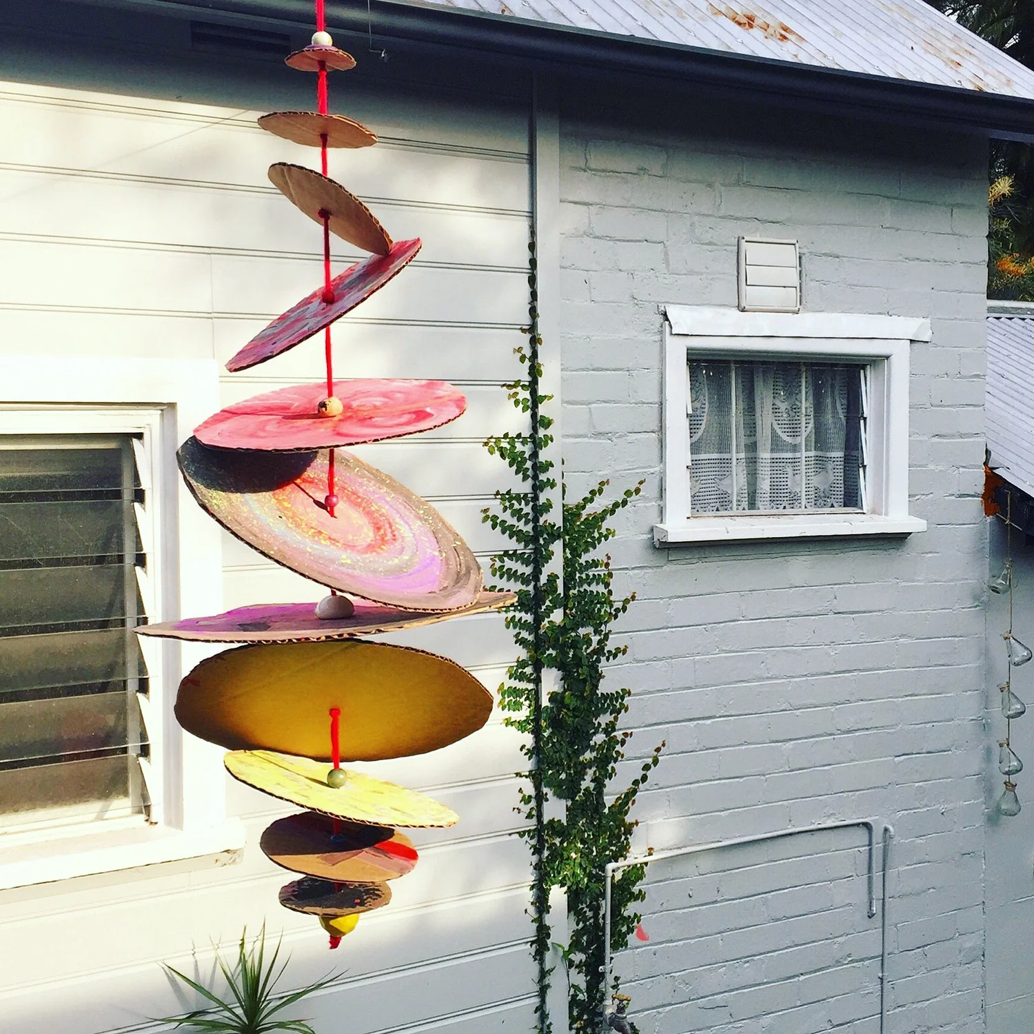 Kinetic cardboard mobile — Handy with Scissors