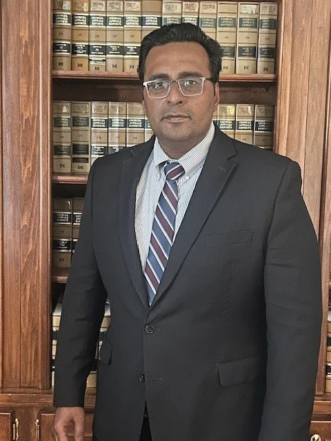 Mohamed Khimani — Lister, Holt & Dennis Law Firm