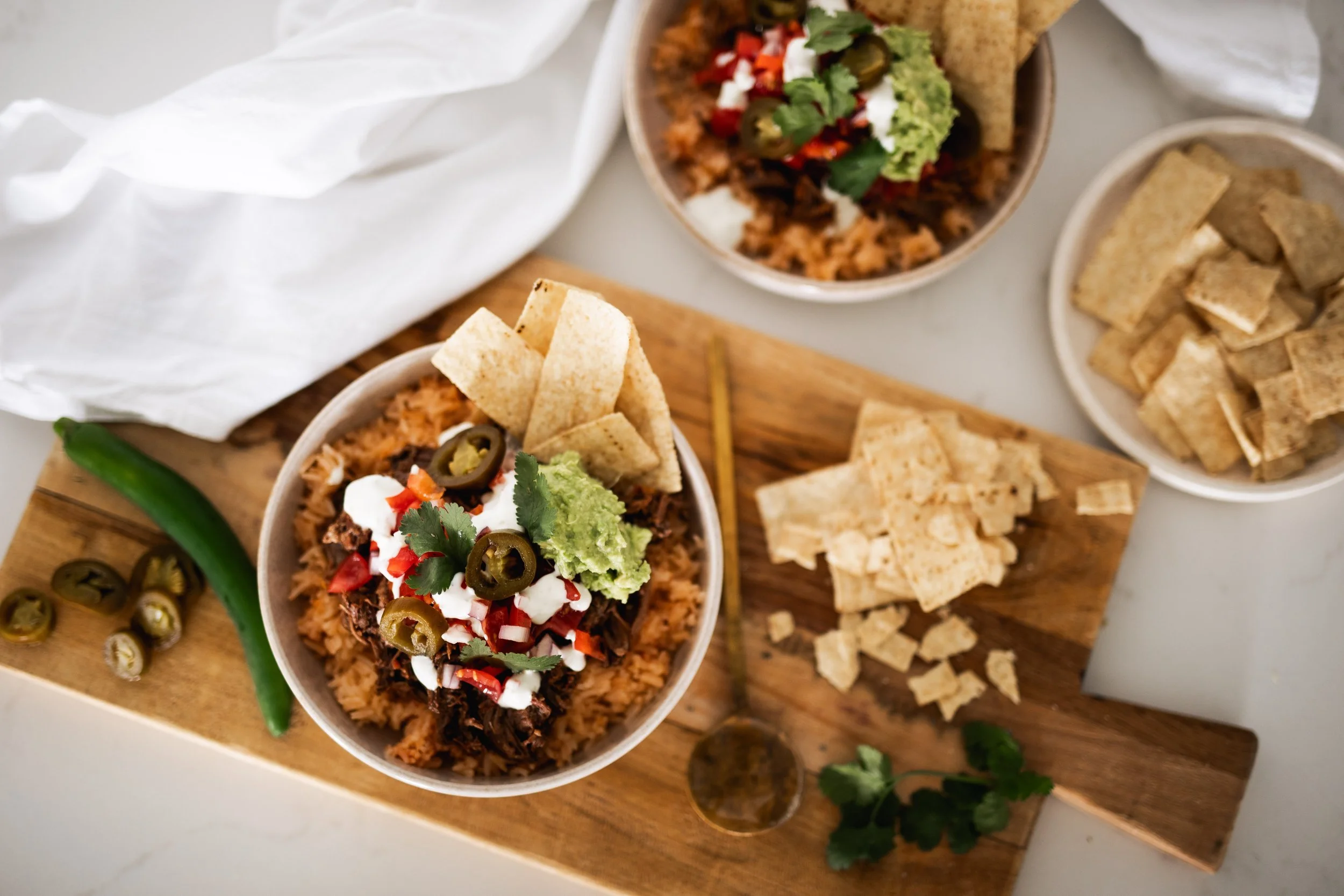 Chipotle pulled beef & red rice bowls with lime crema & tortilla crisps ...
