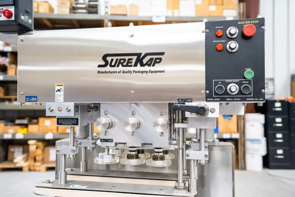 SureKap LLC Story | Excelis — Surekap Automatic Bottle Capping Machines