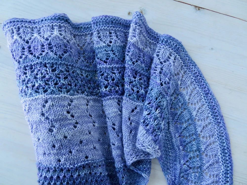 Lace shawl knitting pattern that uses easy yarn over stitches to evoke ...